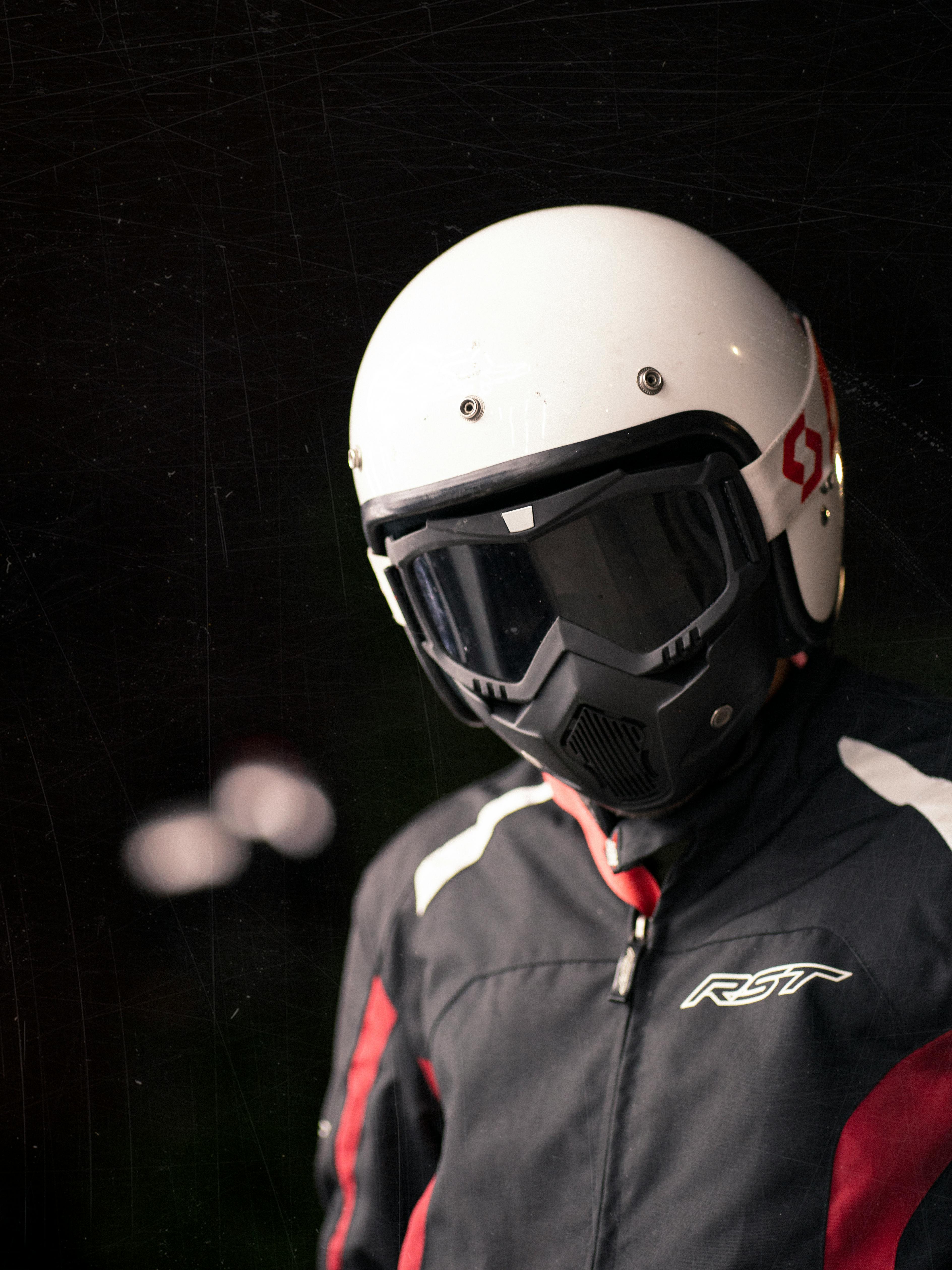 A Person Wearing White Motorcycle Helmet · Free Stock Photo