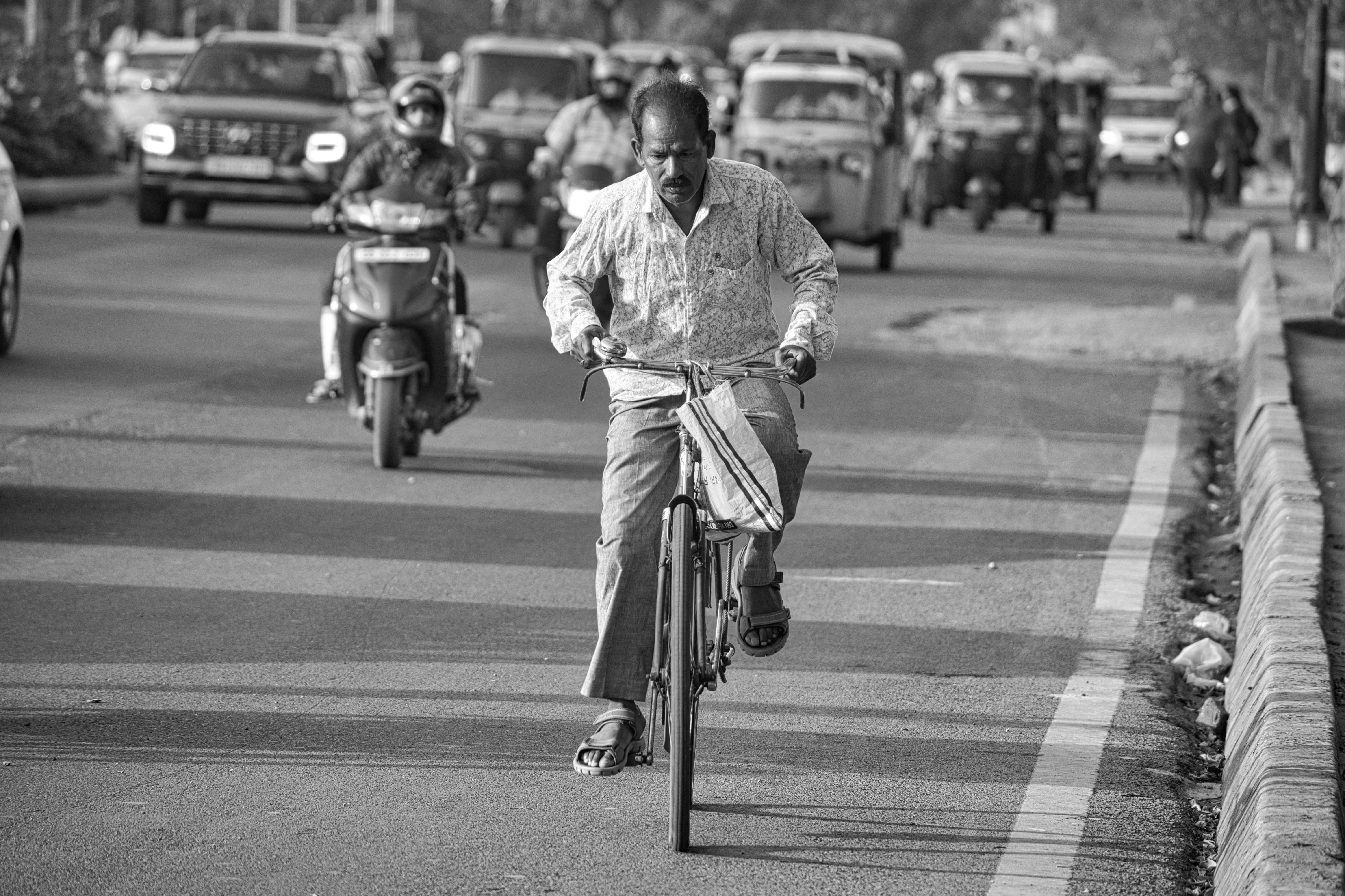 A Man Riding Bicycle on the Street · Free Stock Photo