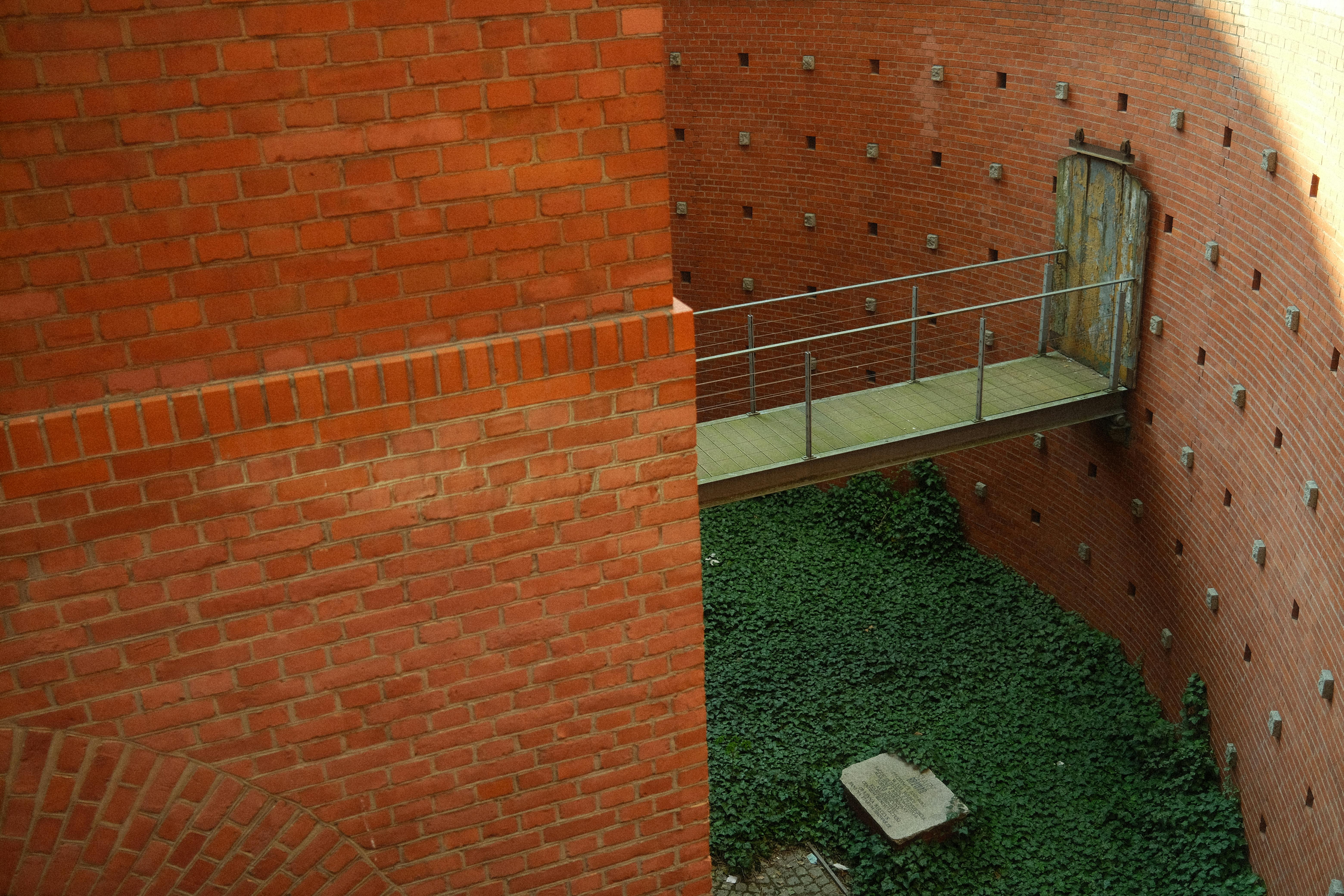 Bridge Between Brick Walls · Free Stock Photo