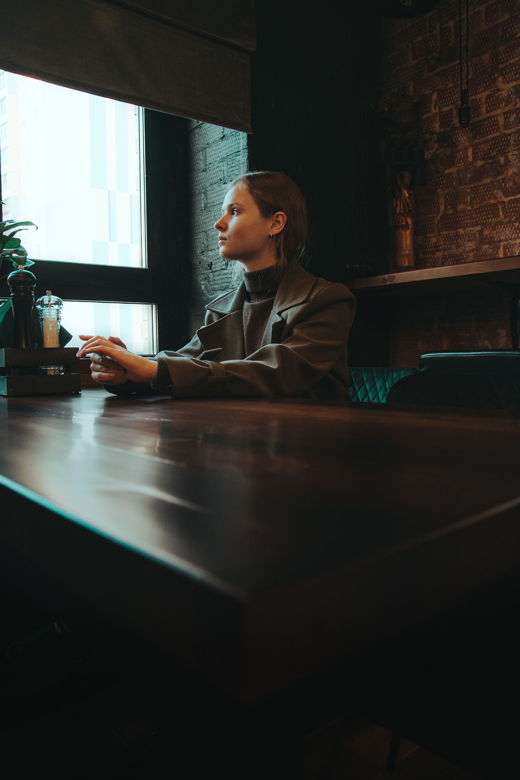 A Woman in Brown Blazer Shirt Sitting at the Table · Free Stock Photo