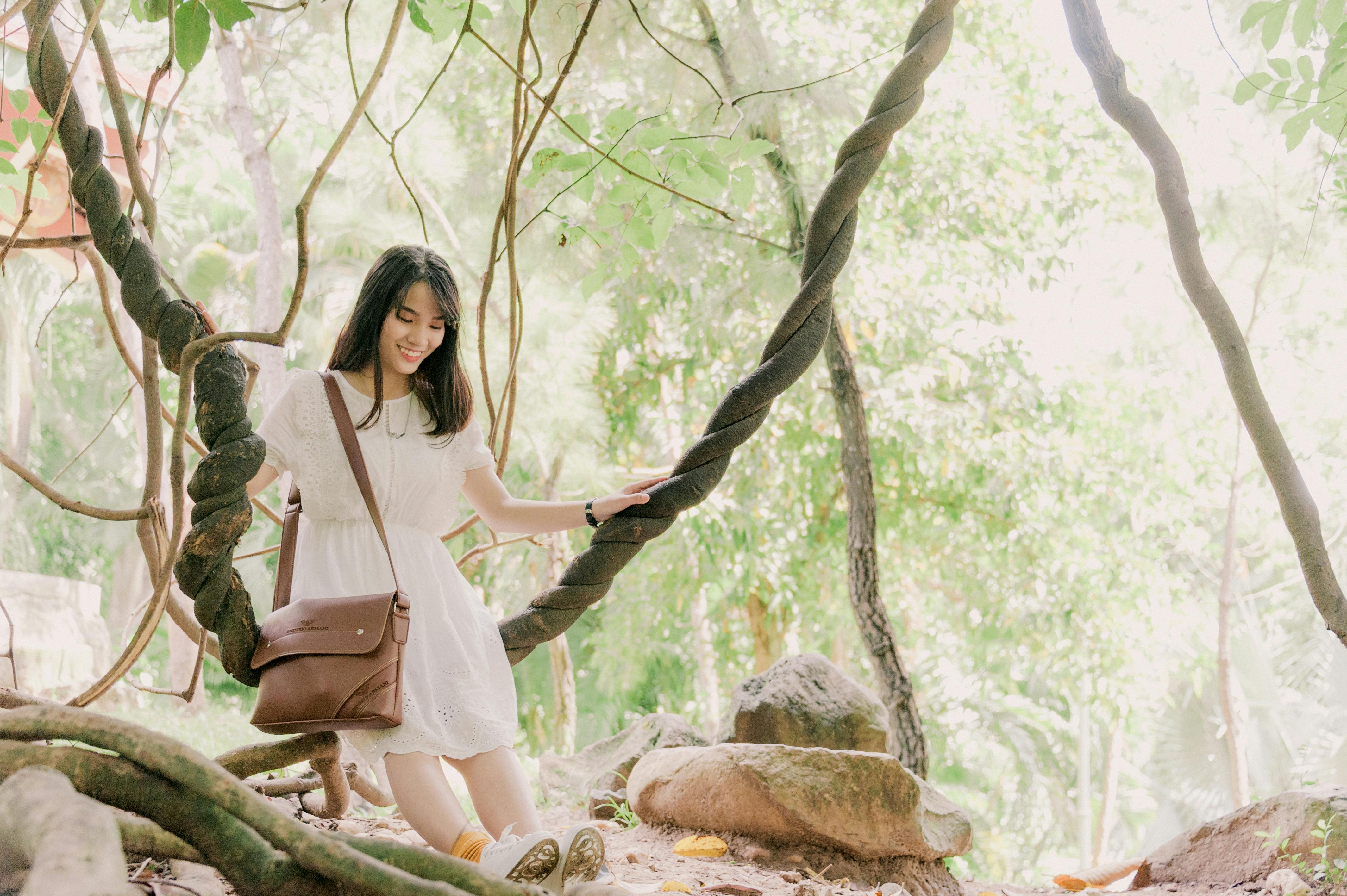 Woman Standing Near Trees · Free Stock Photo