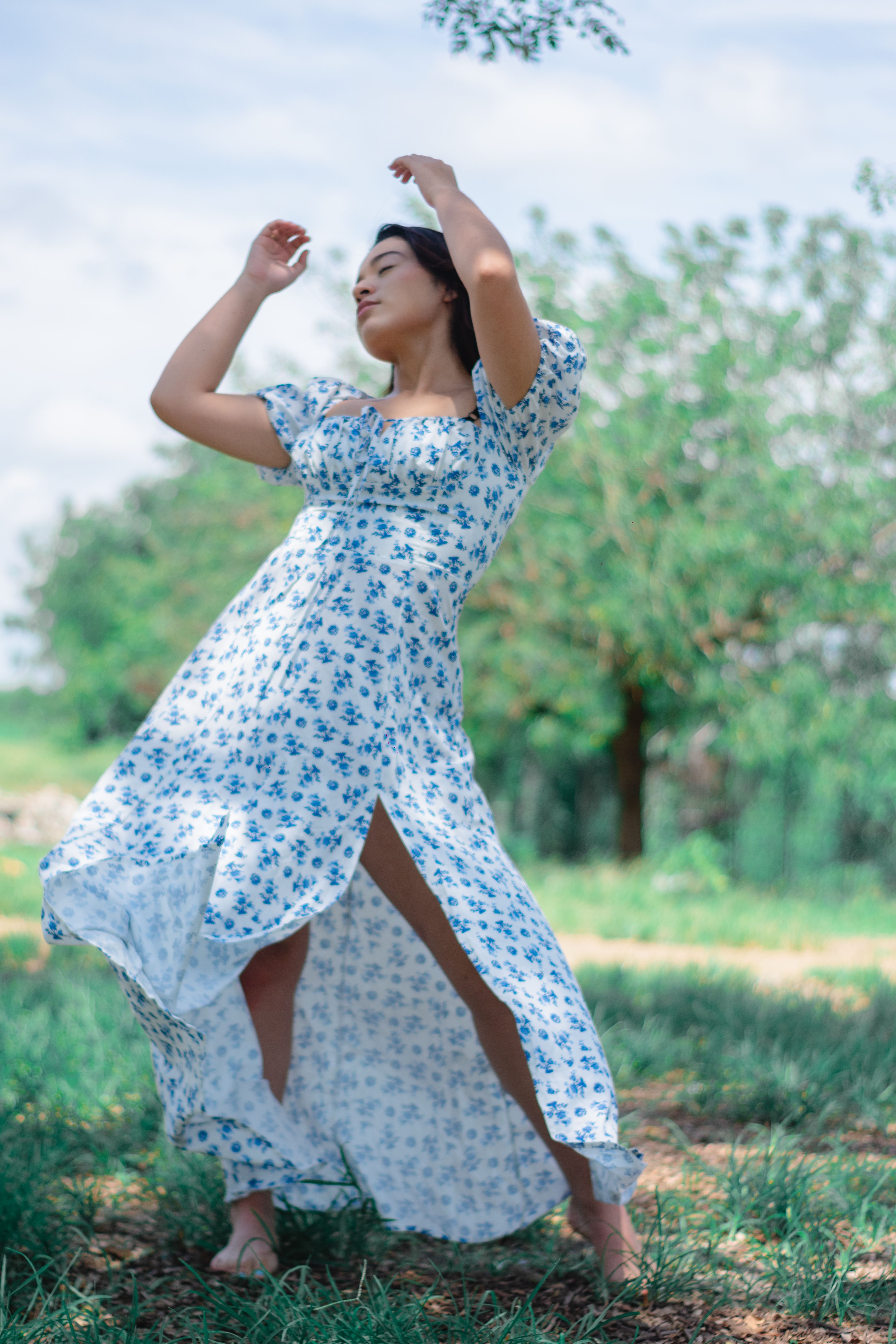 Woman in Dress Dancing in Garden · Free Stock Photo