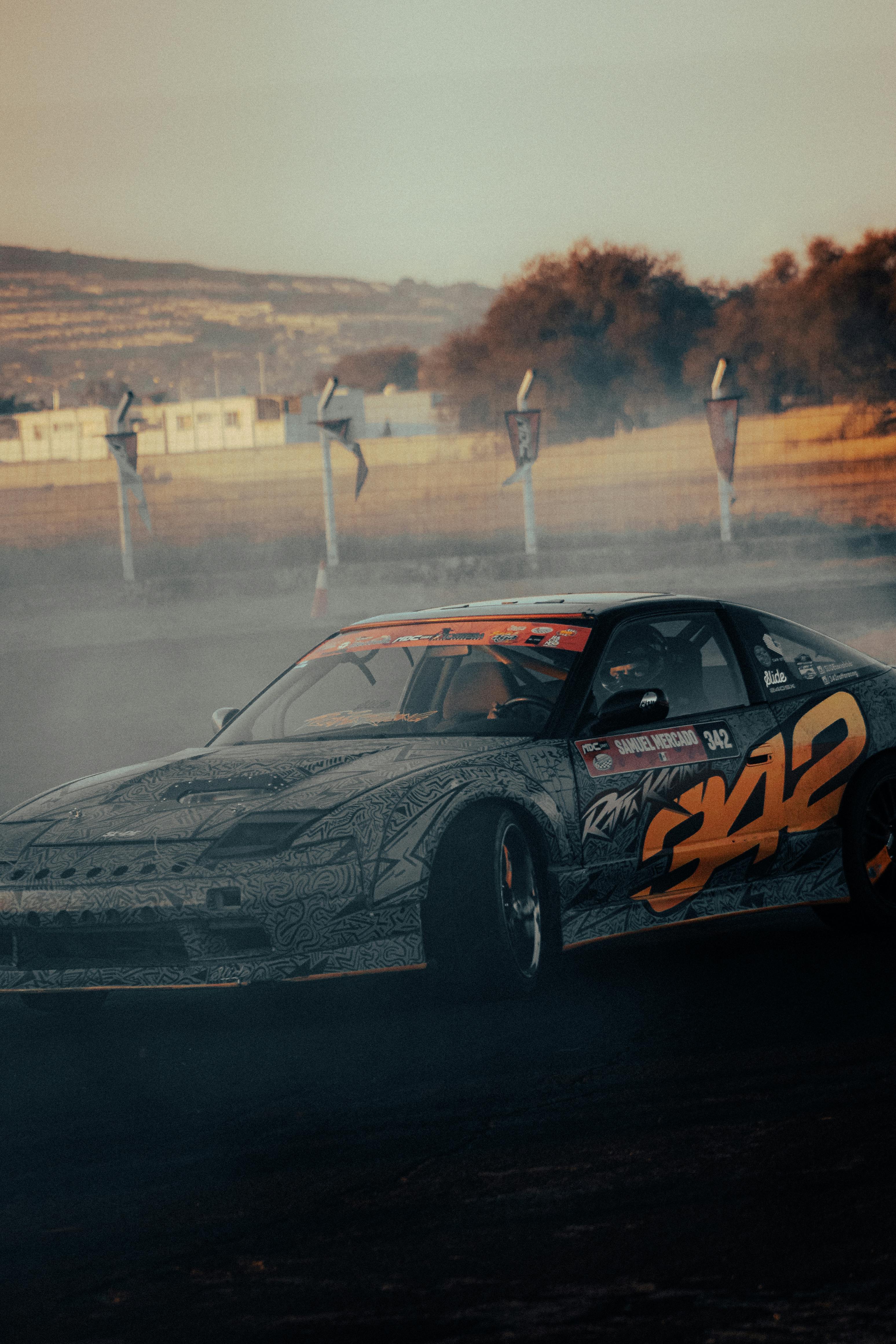 Small rally car driving in city · Free Stock Photo