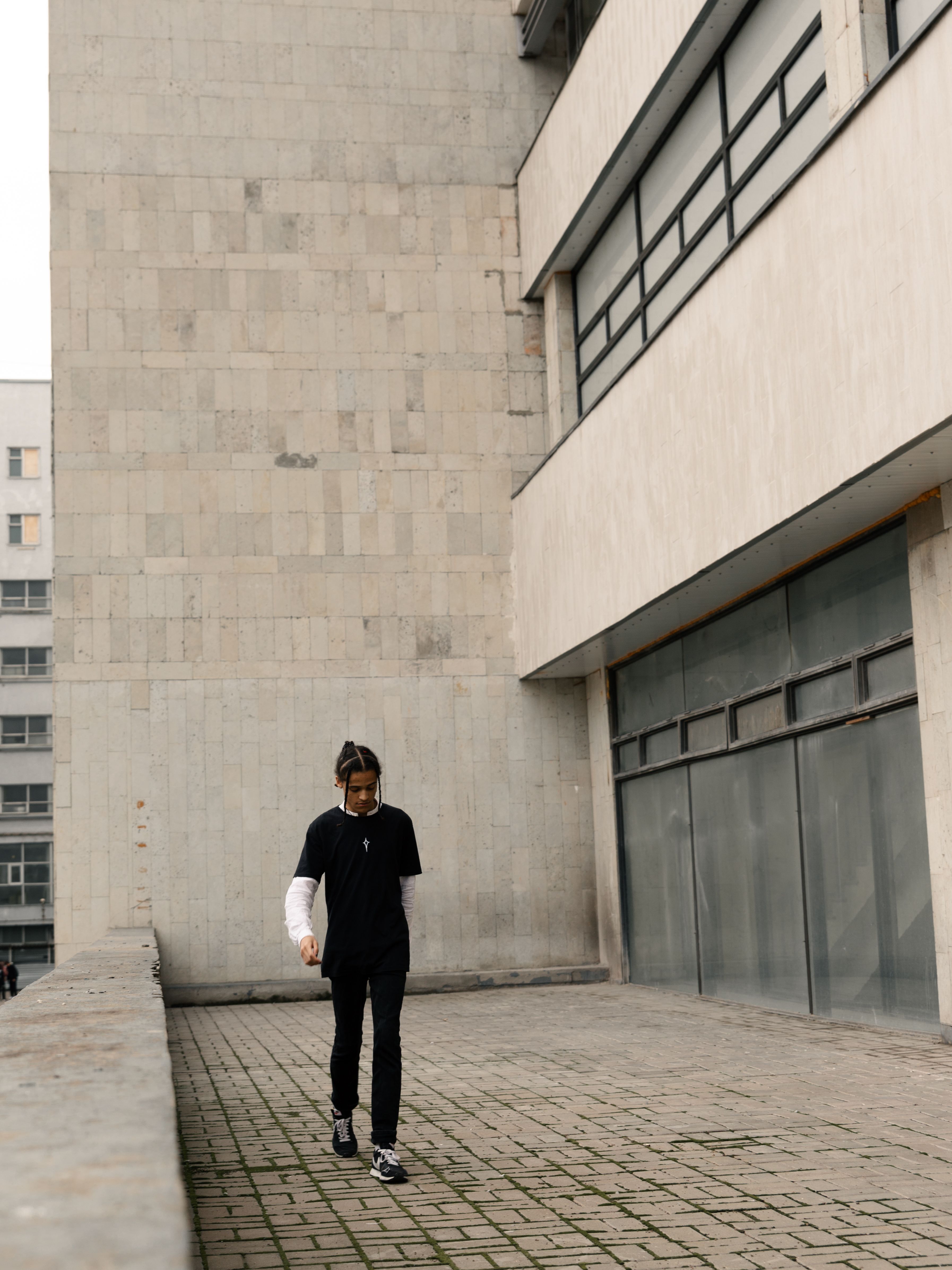 Man near Buildings in Town · Free Stock Photo