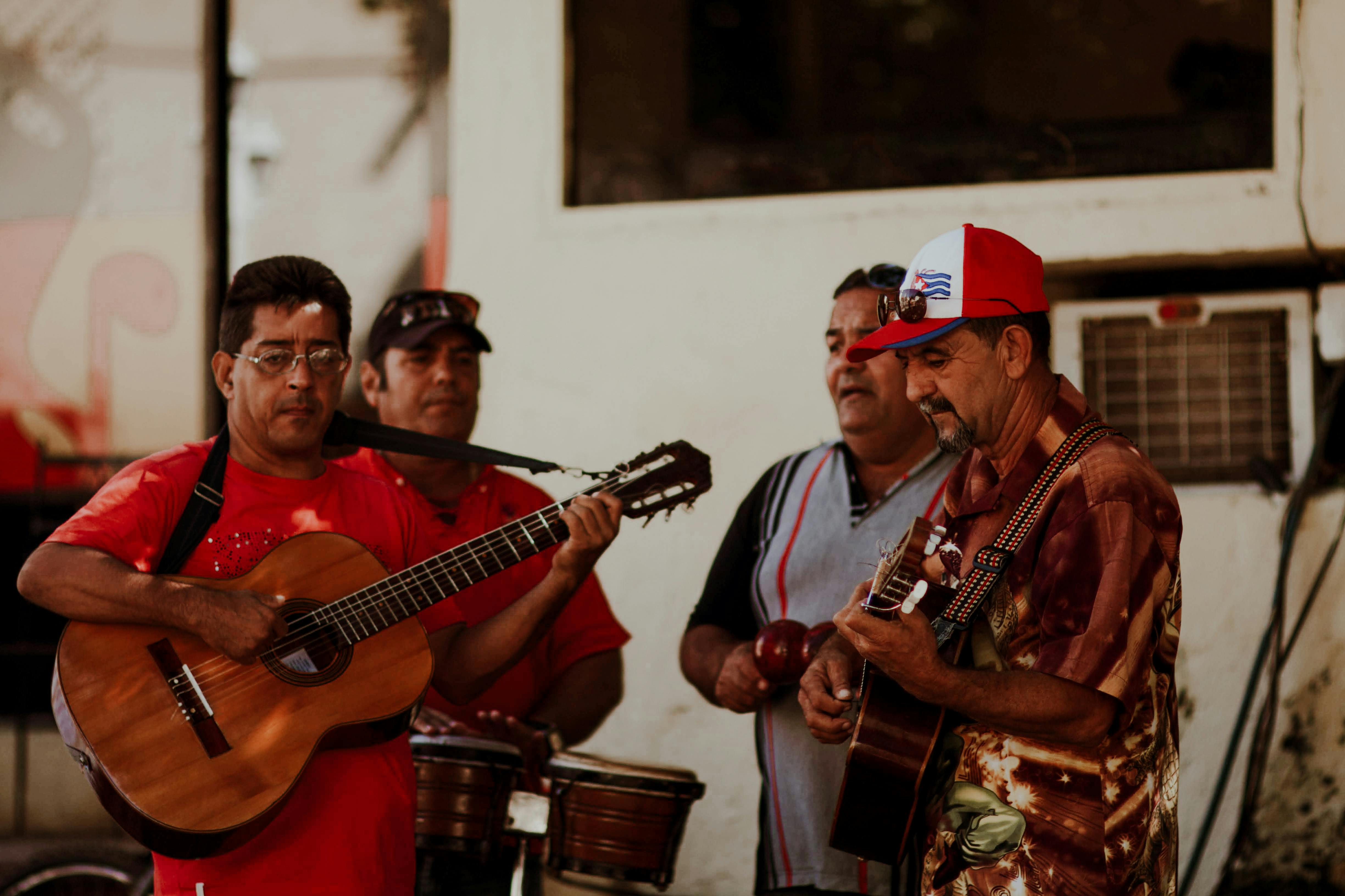 Men Playing Musical Instruments Outdoor · Free Stock Photo