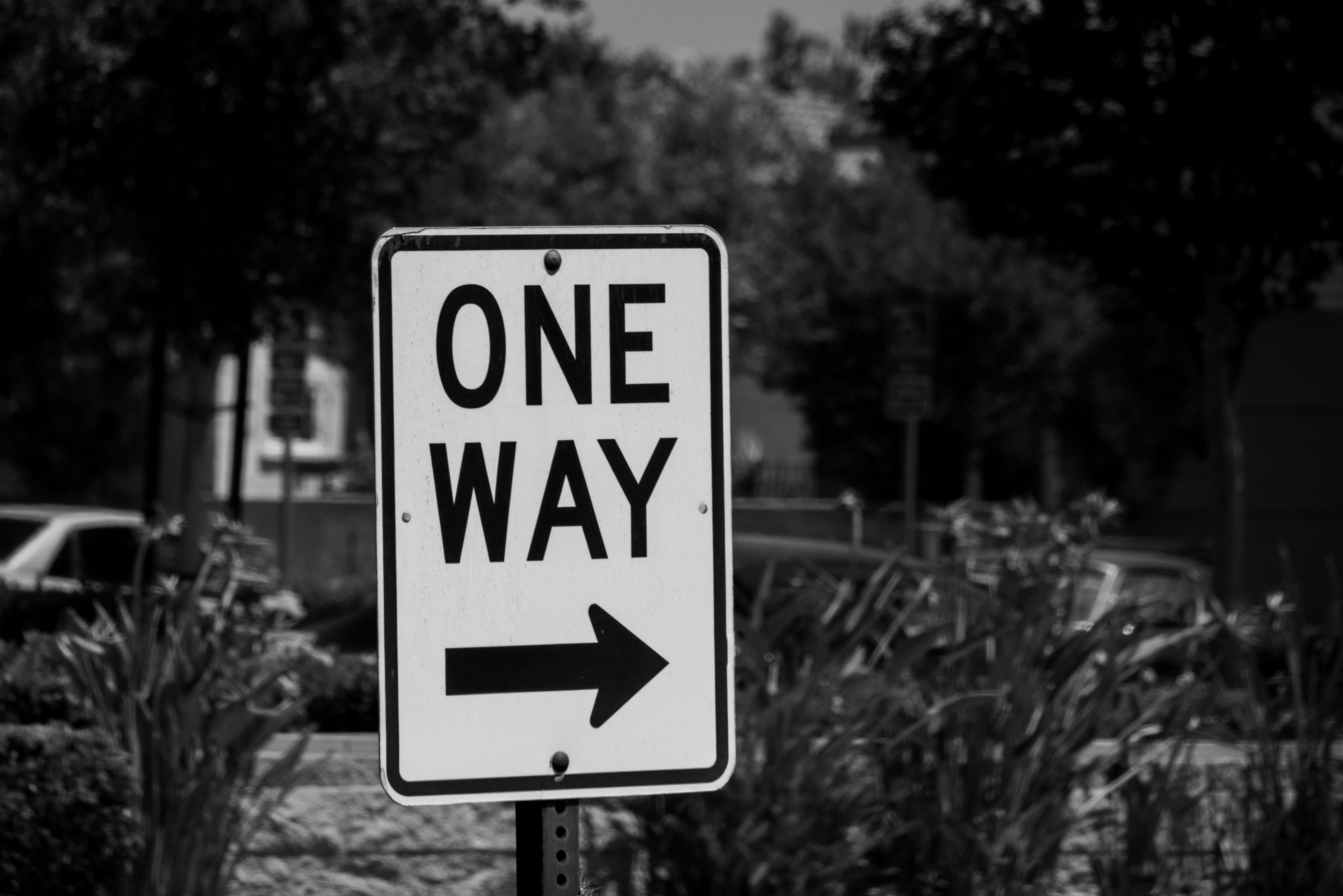 Grayscale Photo of a Road Sign · Free Stock Photo