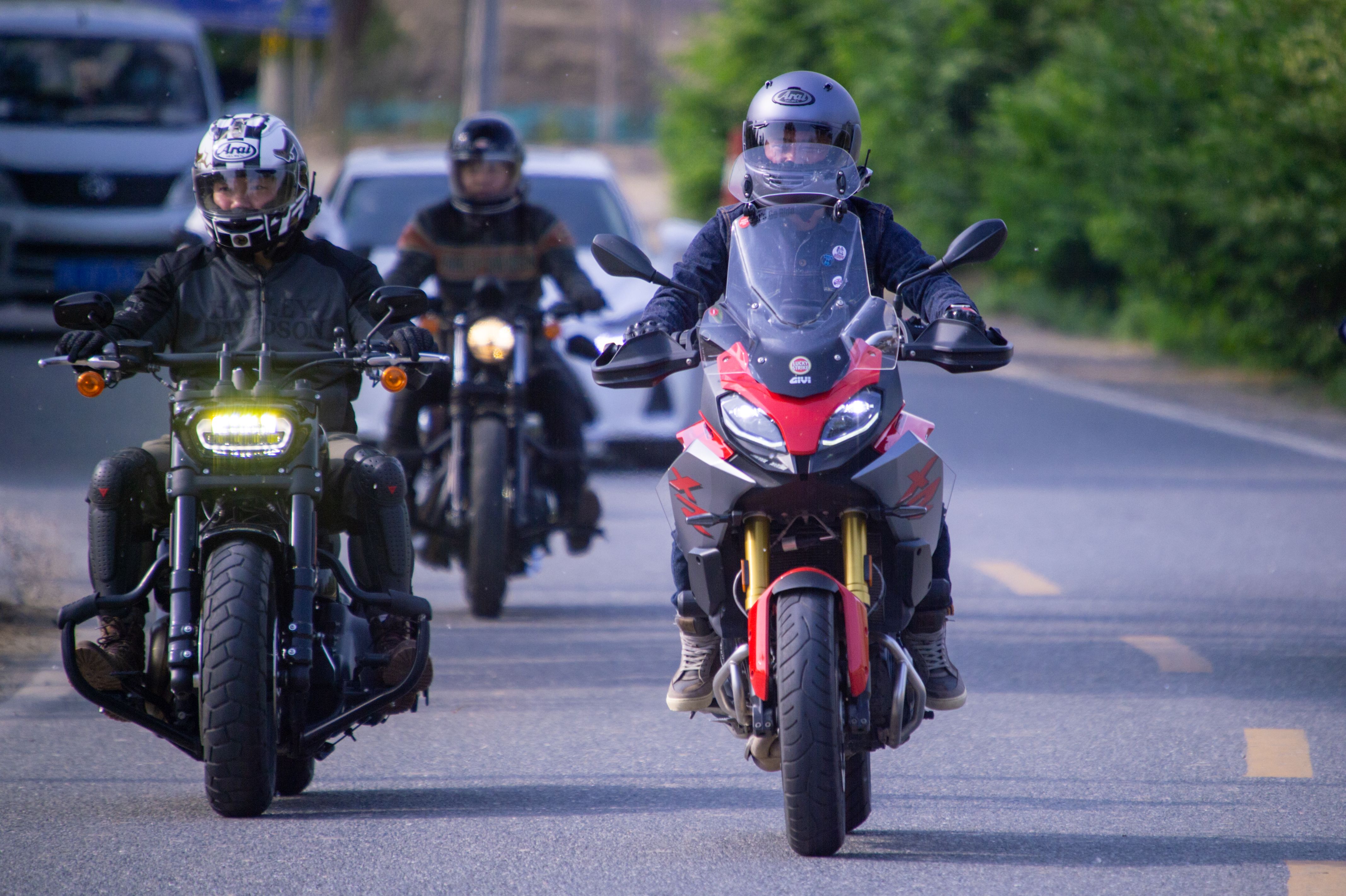 Back View of a Man on a Motorcycle on the Street in City · Free Stock Photo
