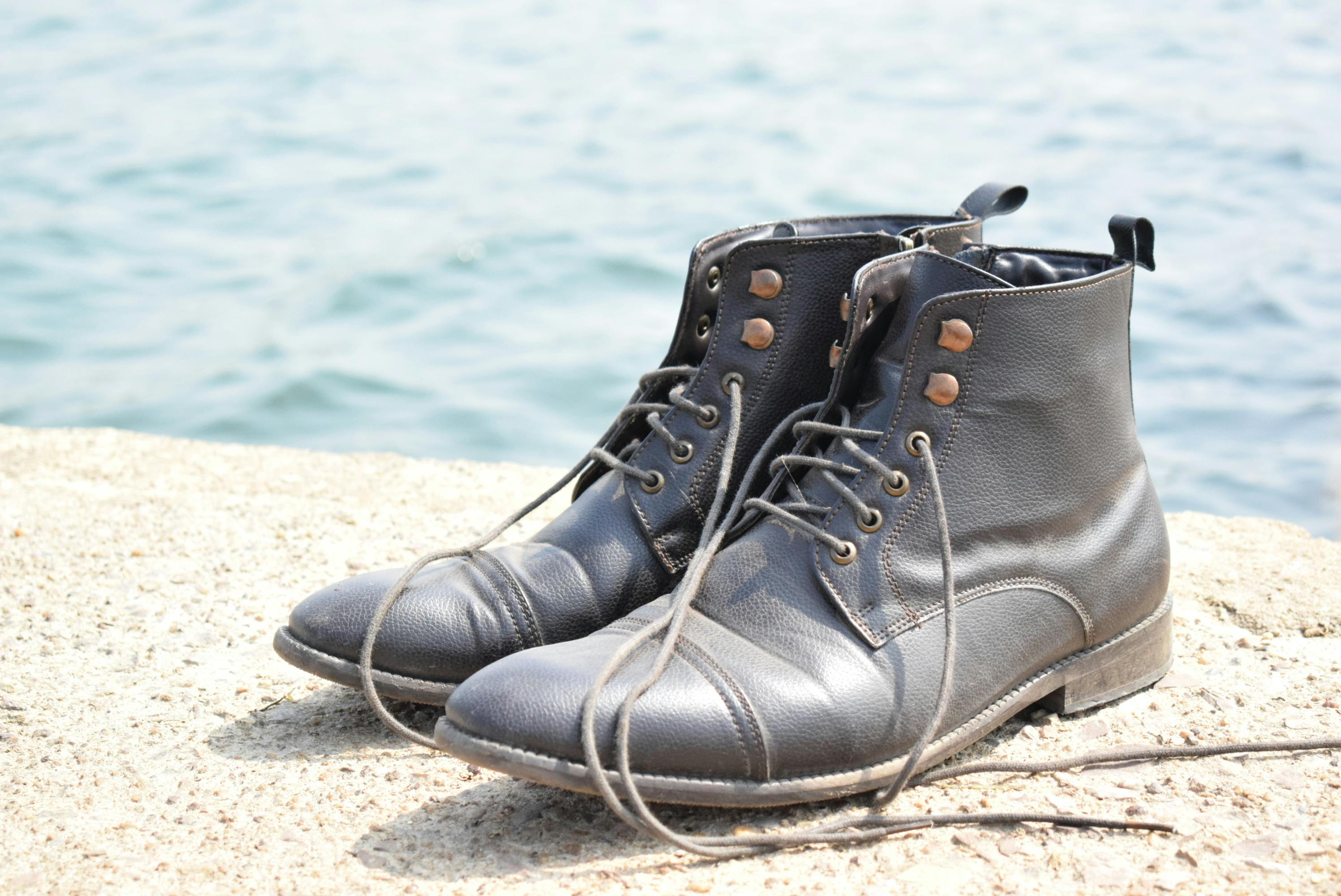 Person Wearing Black Leather Boots · Free Stock Photo