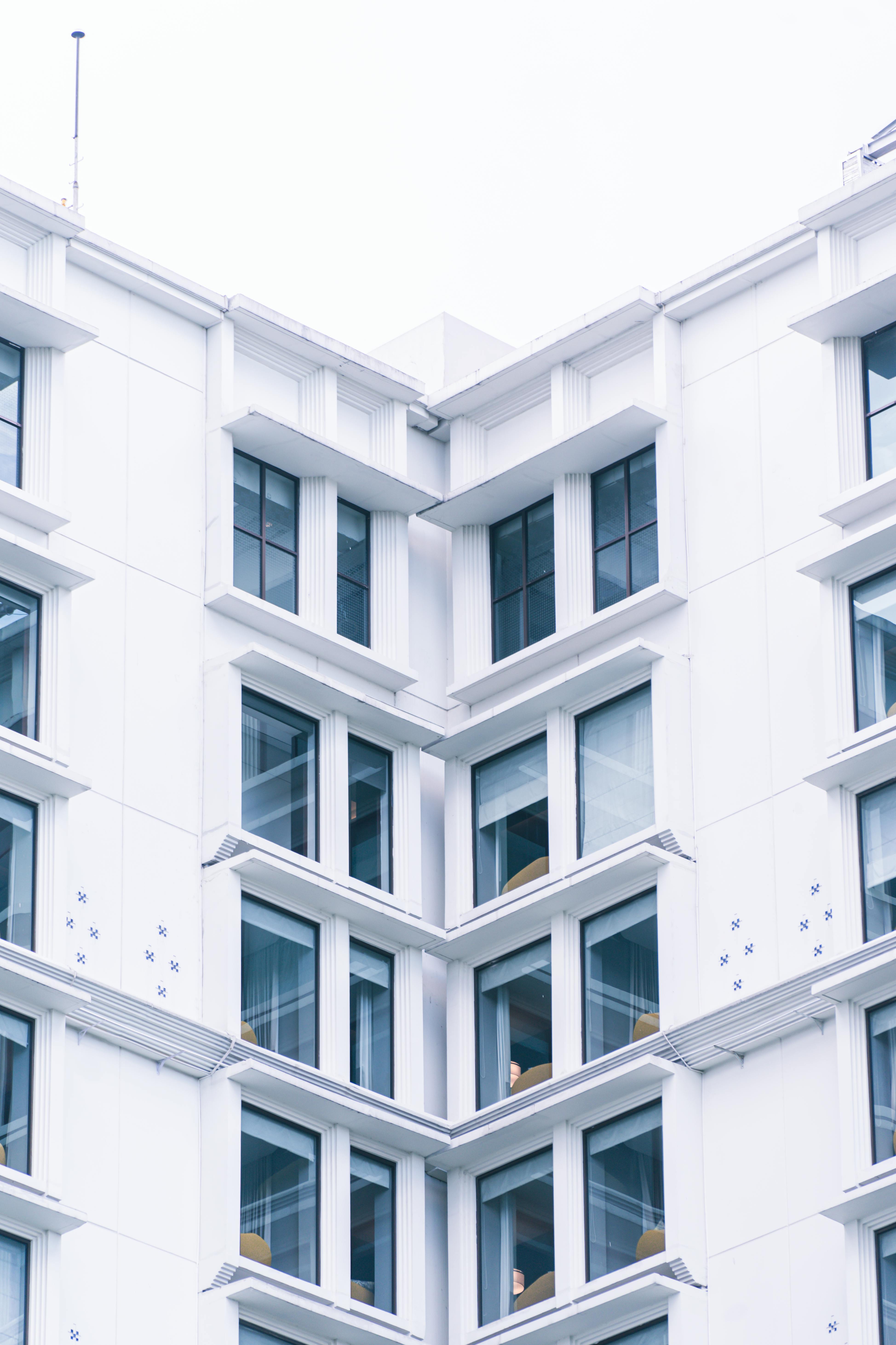 Glass Windows of an Apartment Building · Free Stock Photo