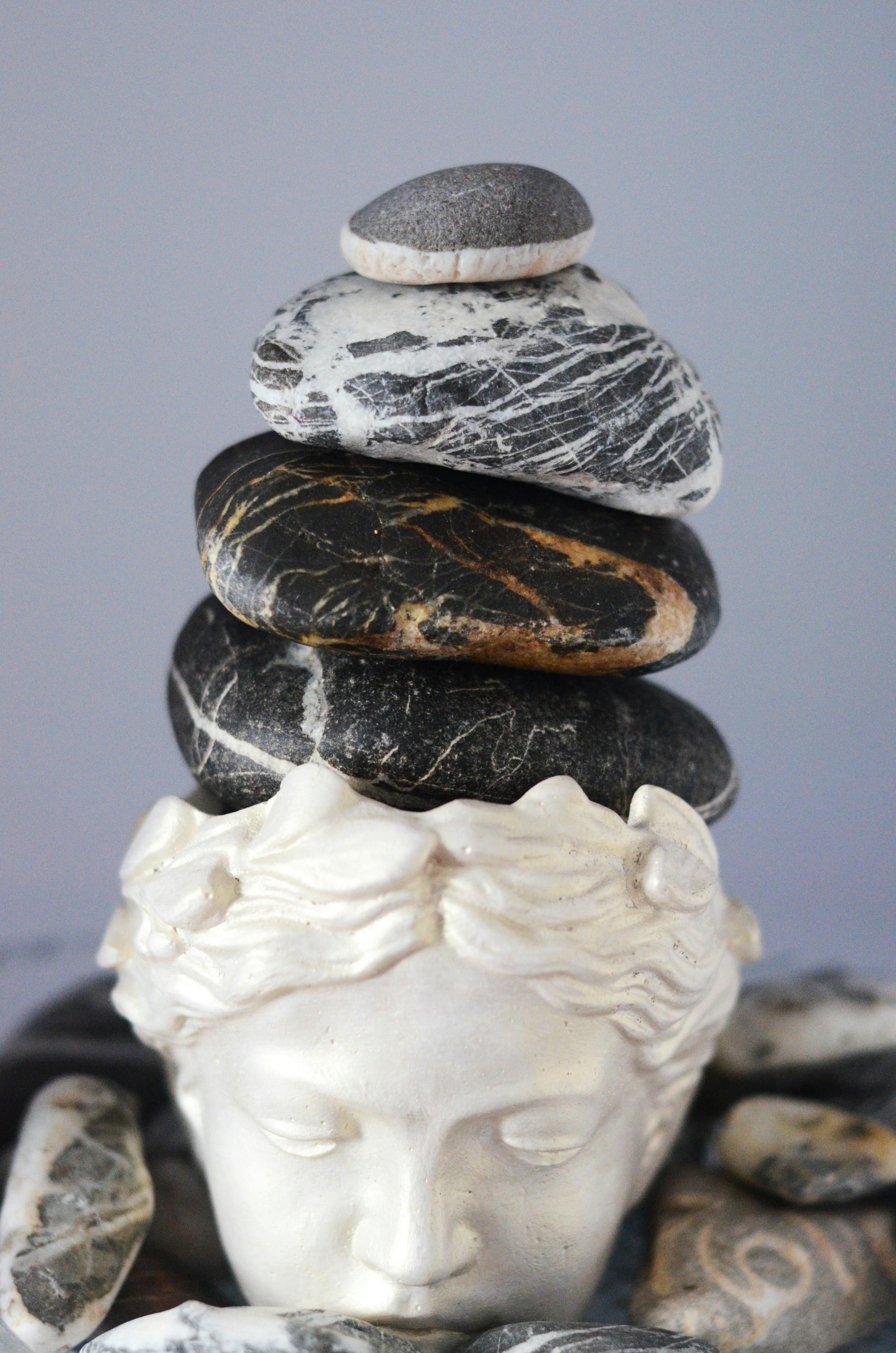 Rocks on a Statue · Free Stock Photo