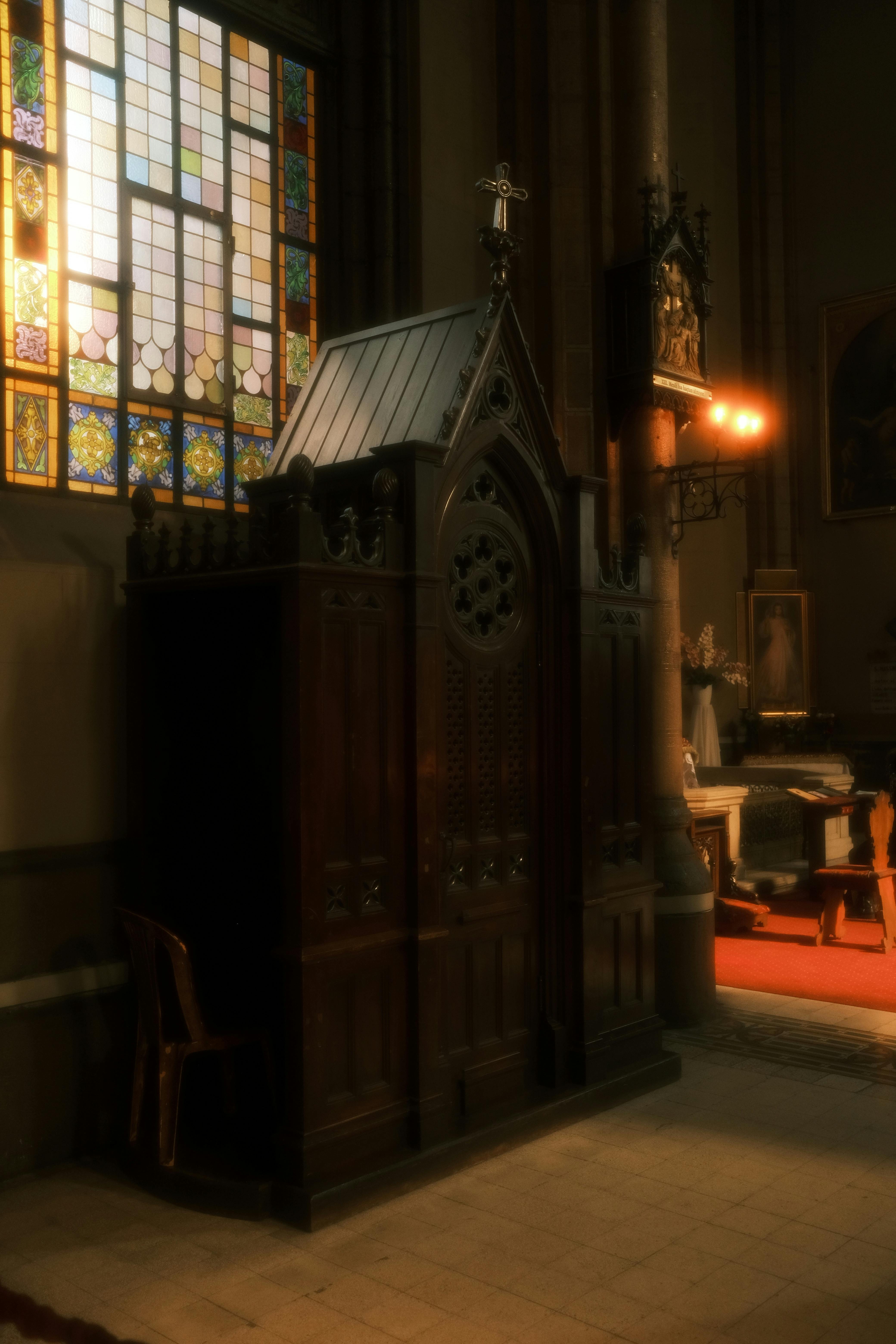 A Person Inside a Confessional · Free Stock Photo