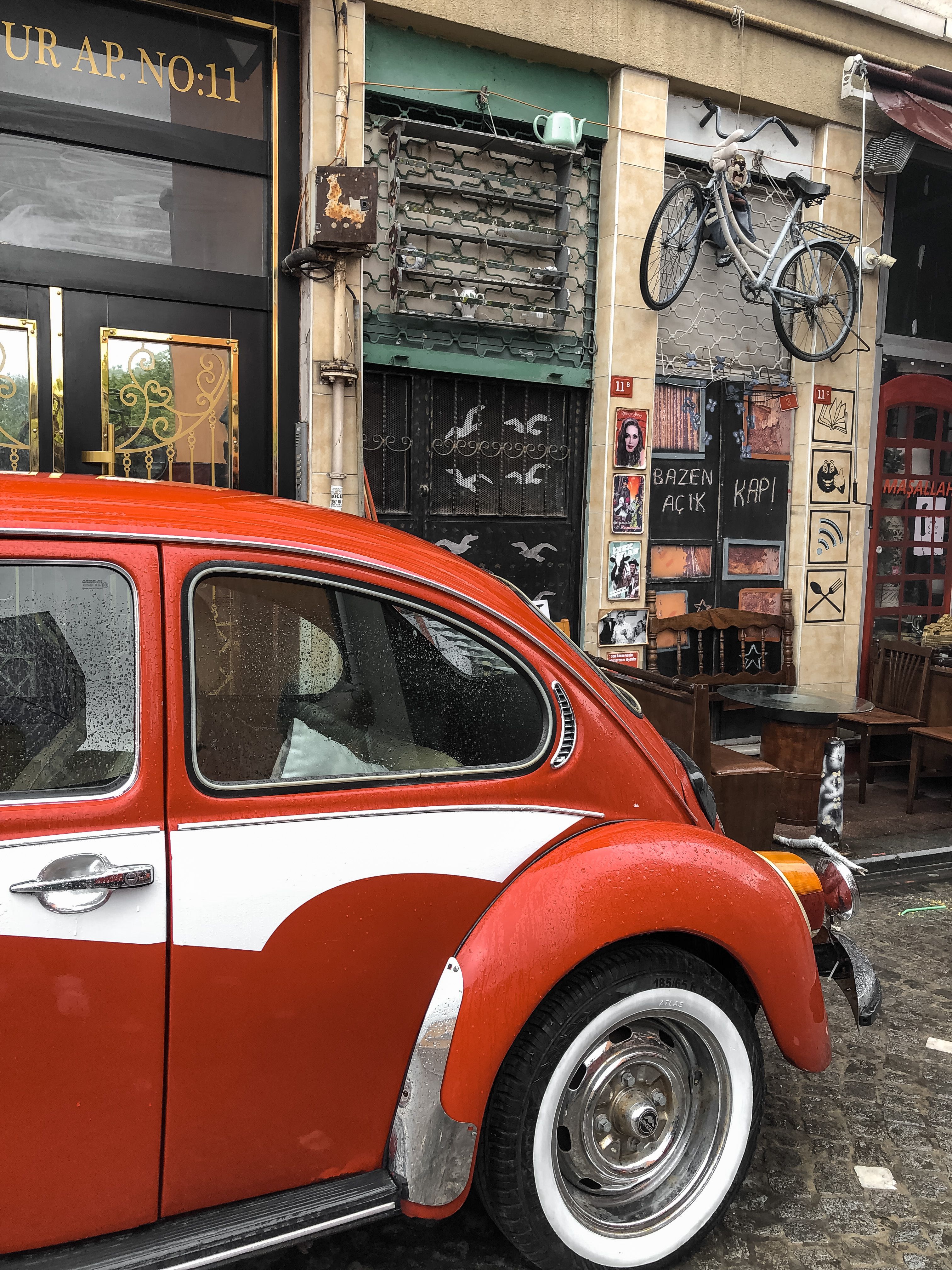 Red Car Parked in Front of White and Brick Building · Free Stock Photo