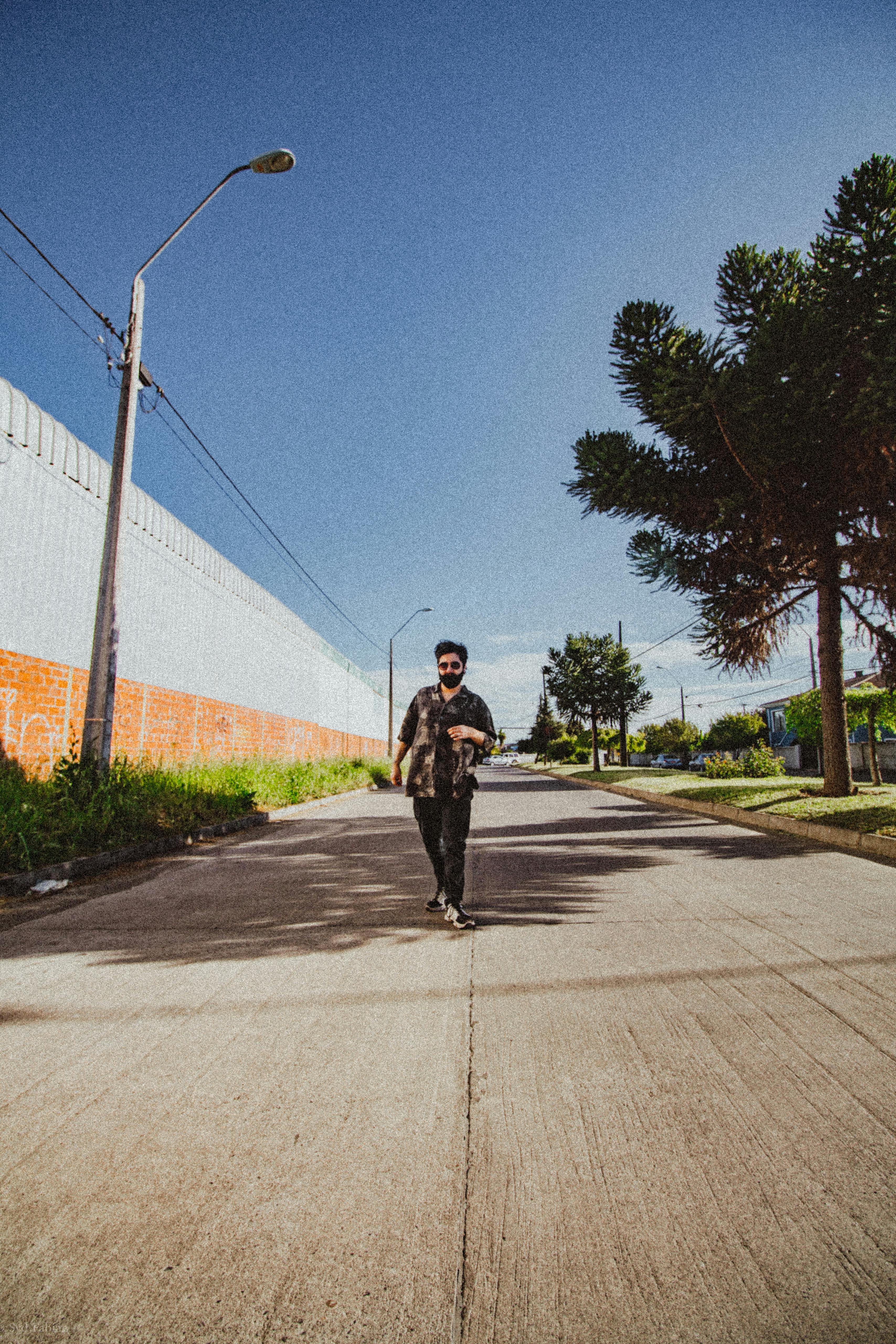 Man Walking on Road · Free Stock Photo