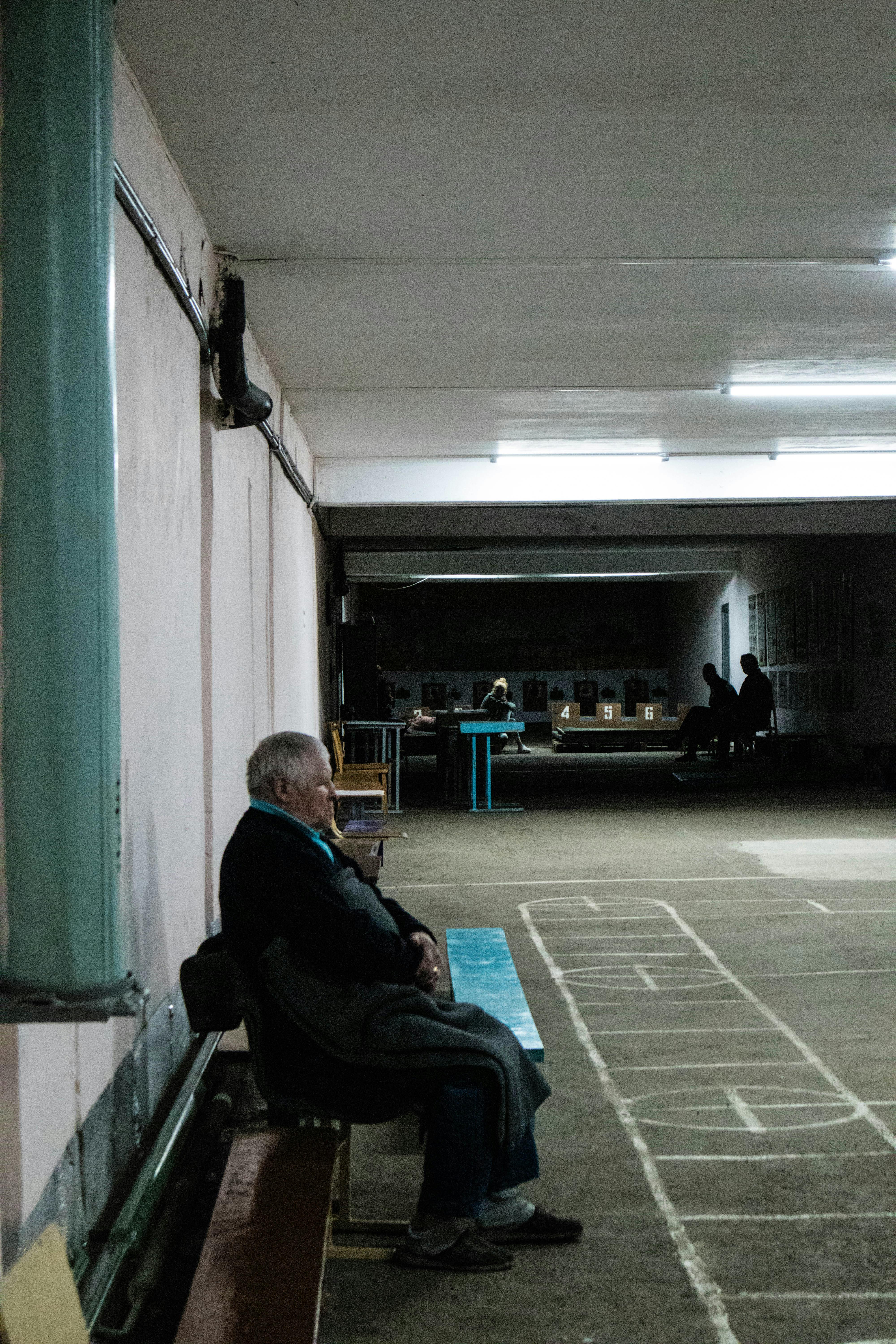 People Sitting on Benches · Free Stock Photo