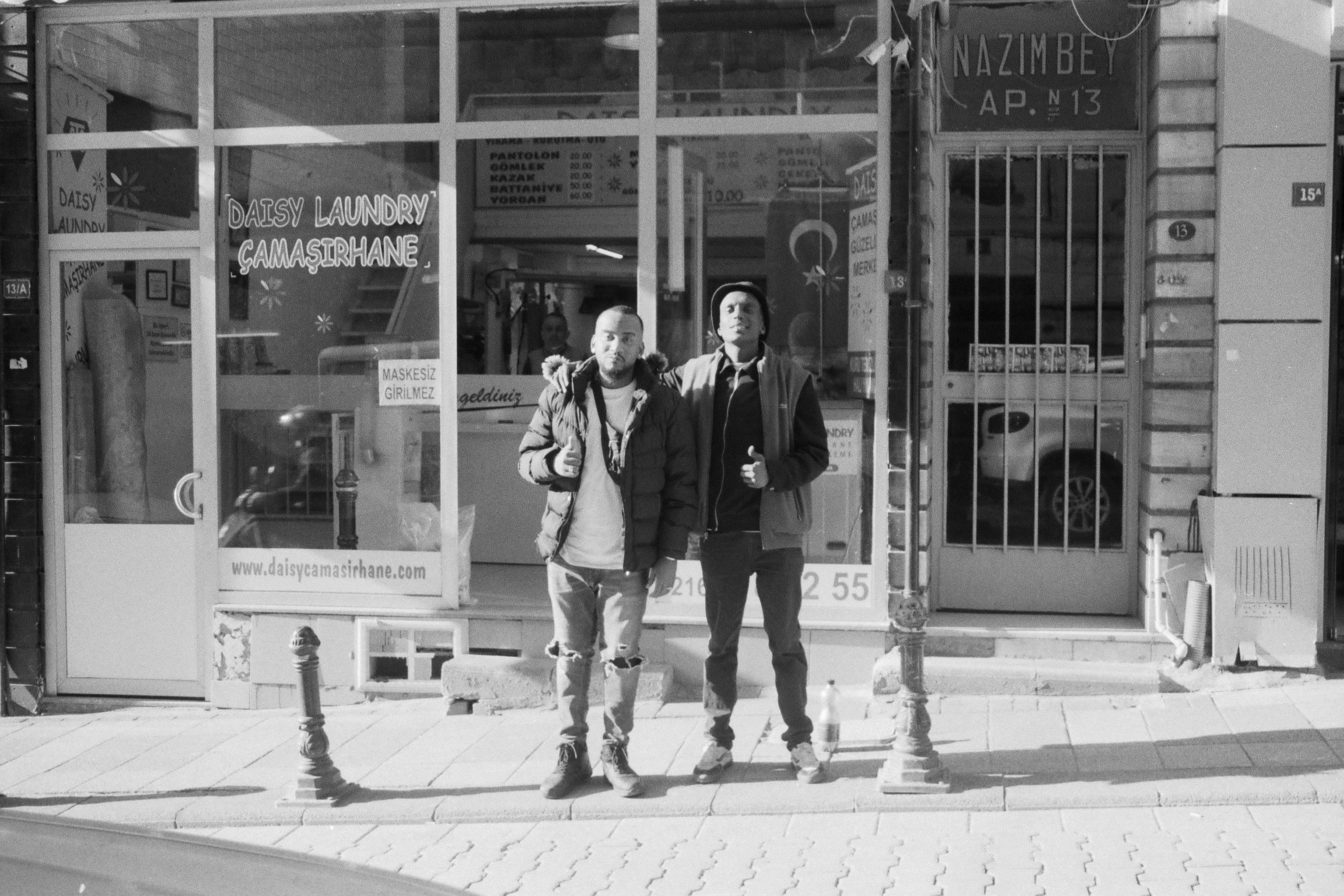 Two Men Standing Together · Free Stock Photo