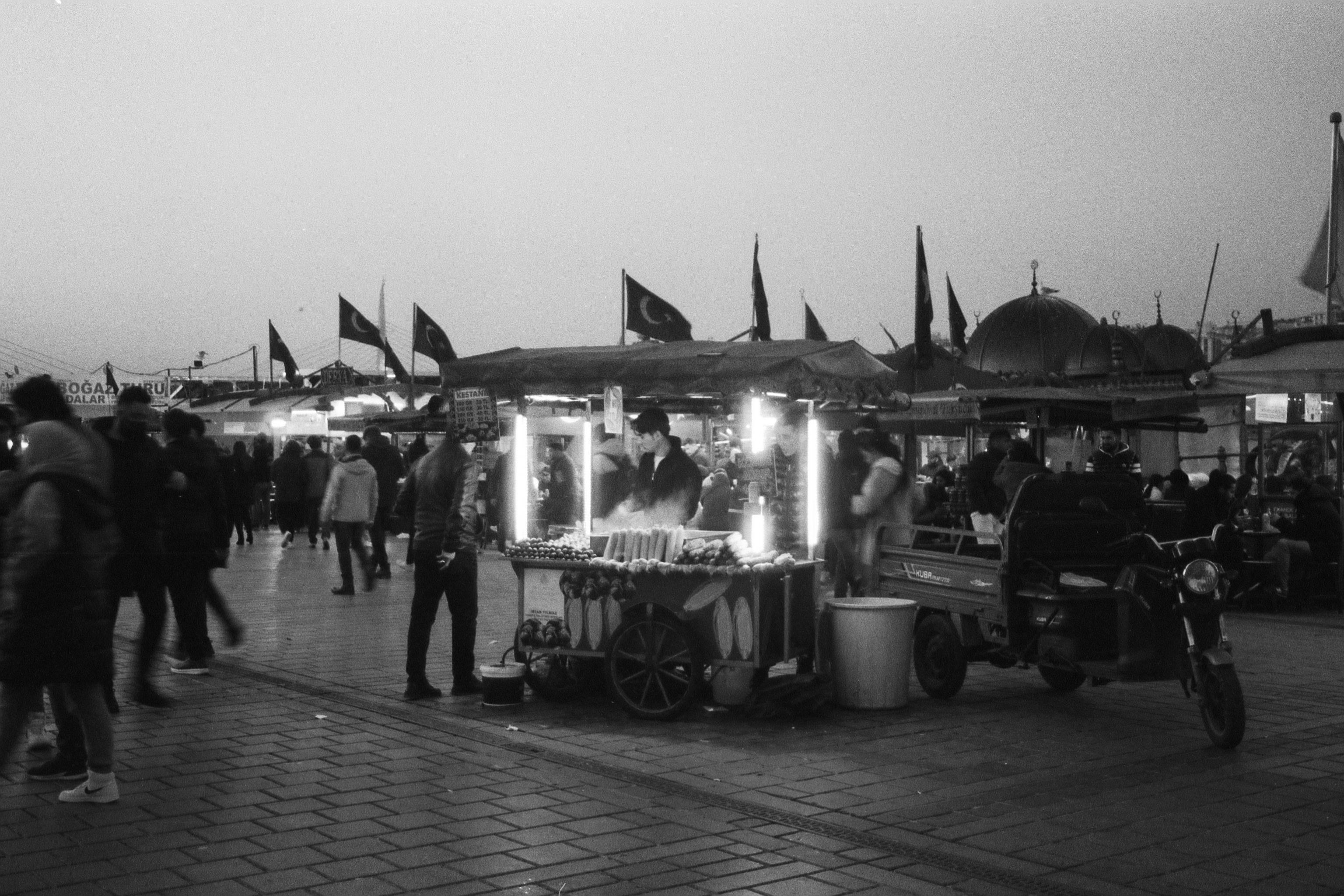 Crowd of Fans Waiting in front of a Stall with Official Merchandise of ...