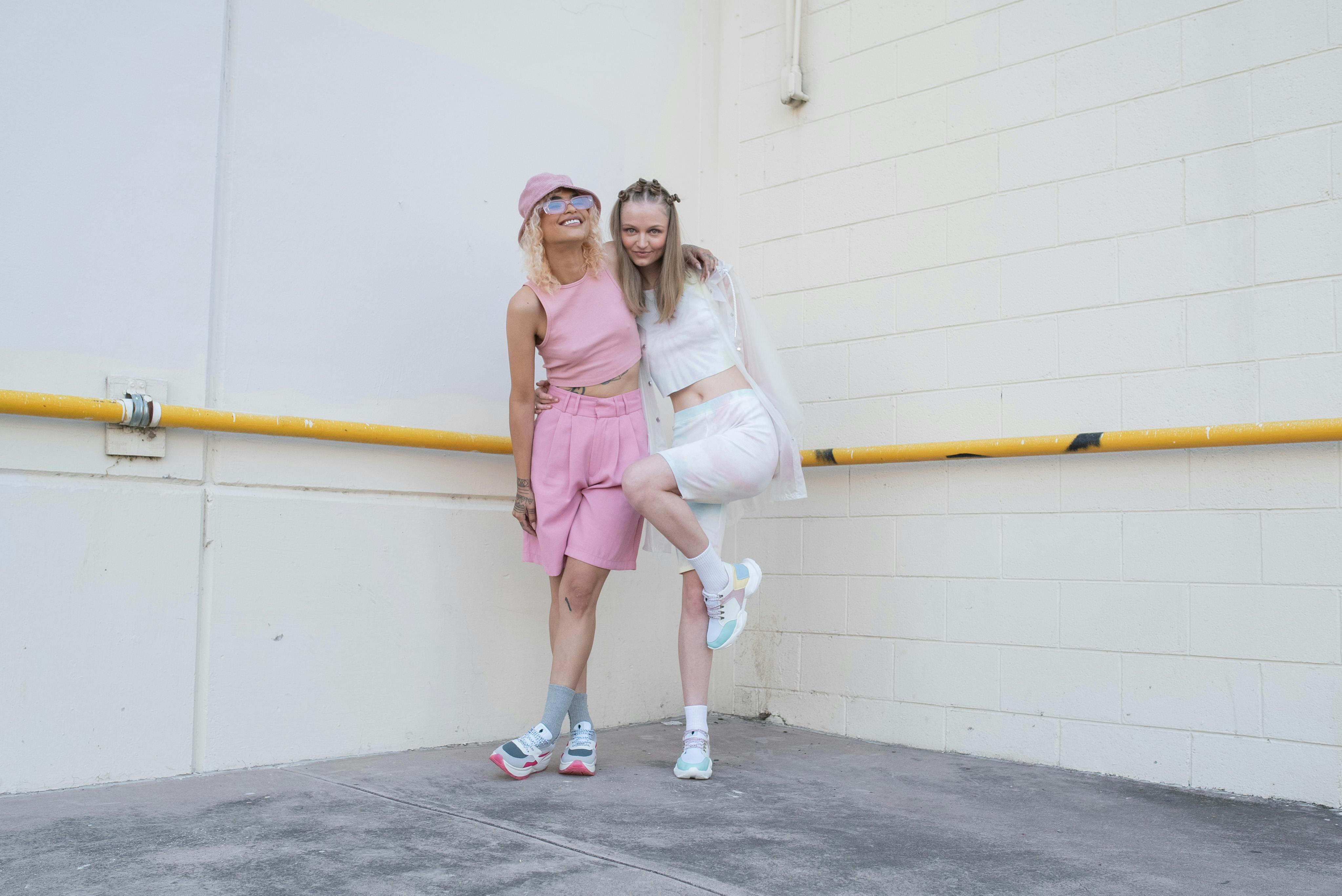 Two Female Models in Pink and White Outfits Posing Together · Free ...