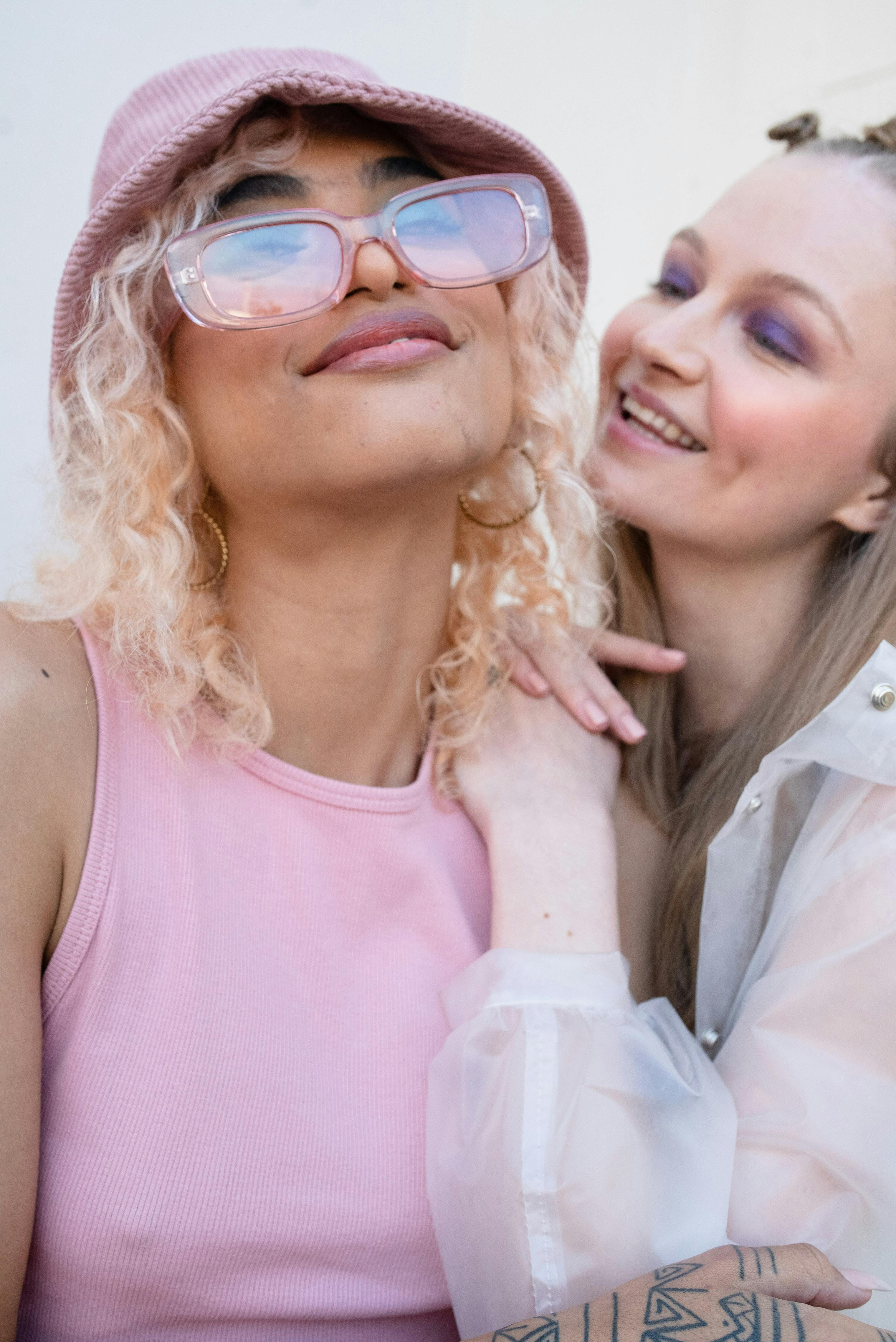 A Woman Wearing Eyeglasses and a Bucket Hat · Free Stock Photo