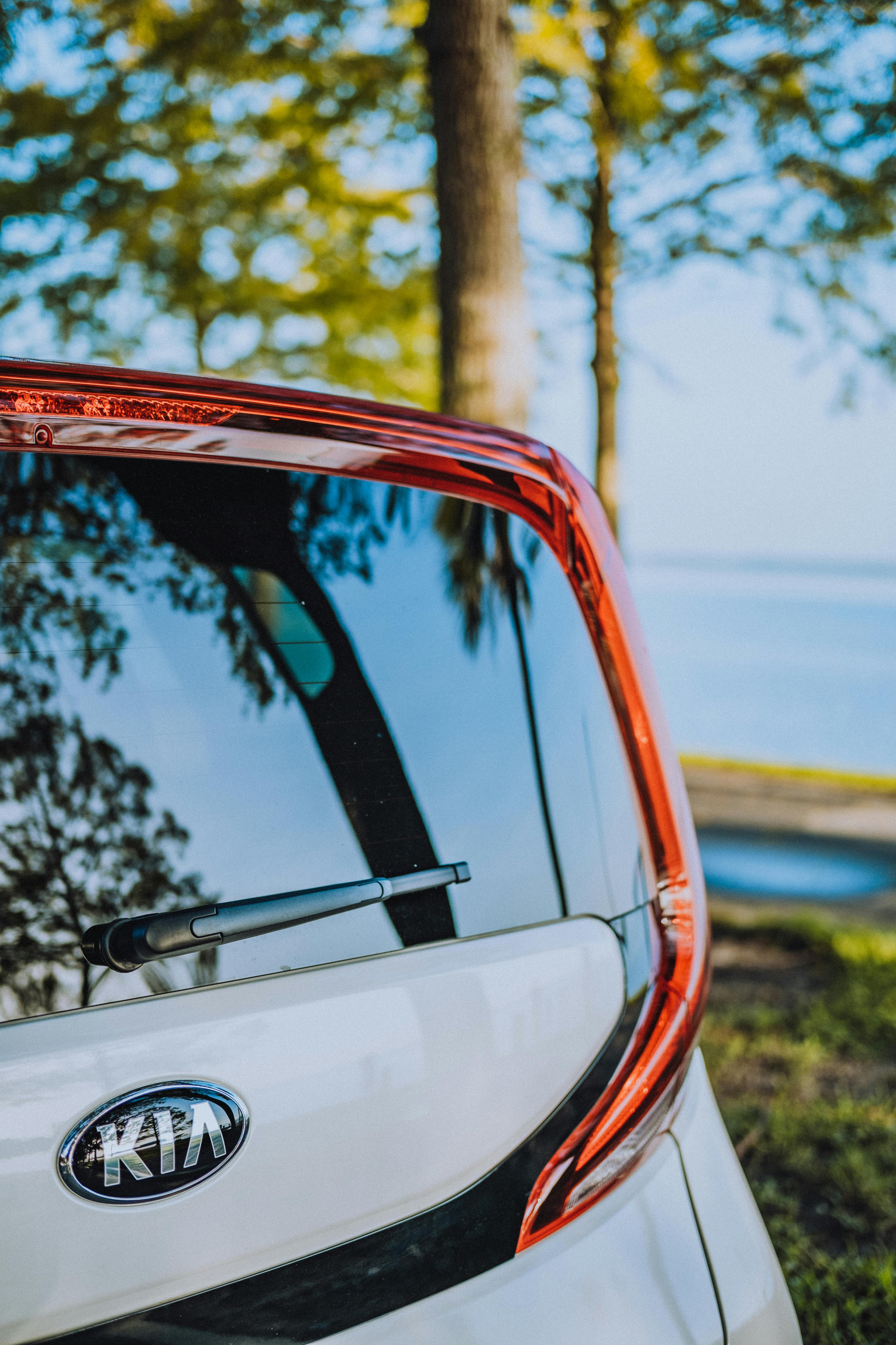 Rear Windshield of a White Kia Car · Free Stock Photo