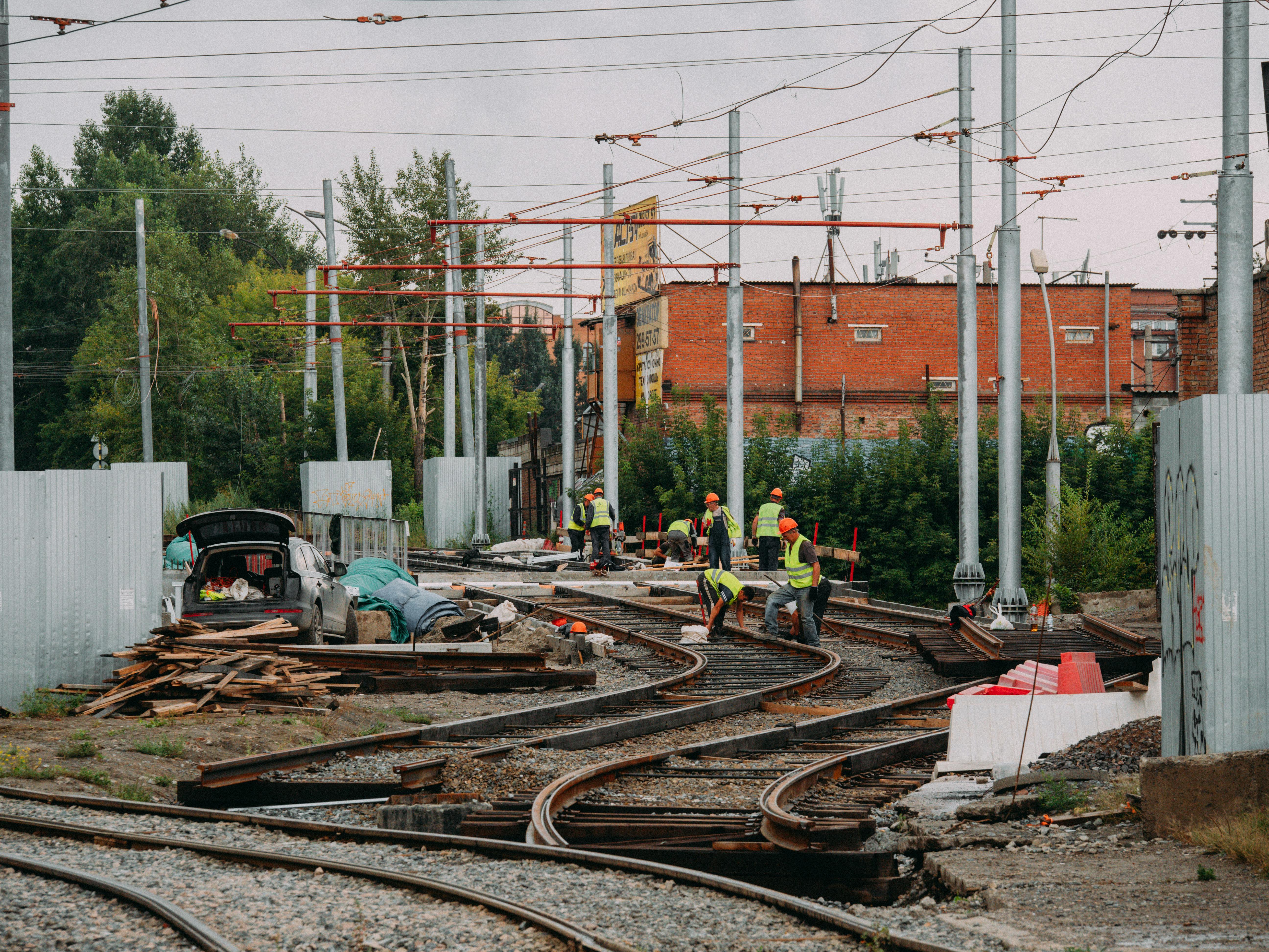People Working on Train Tracks · Free Stock Photo
