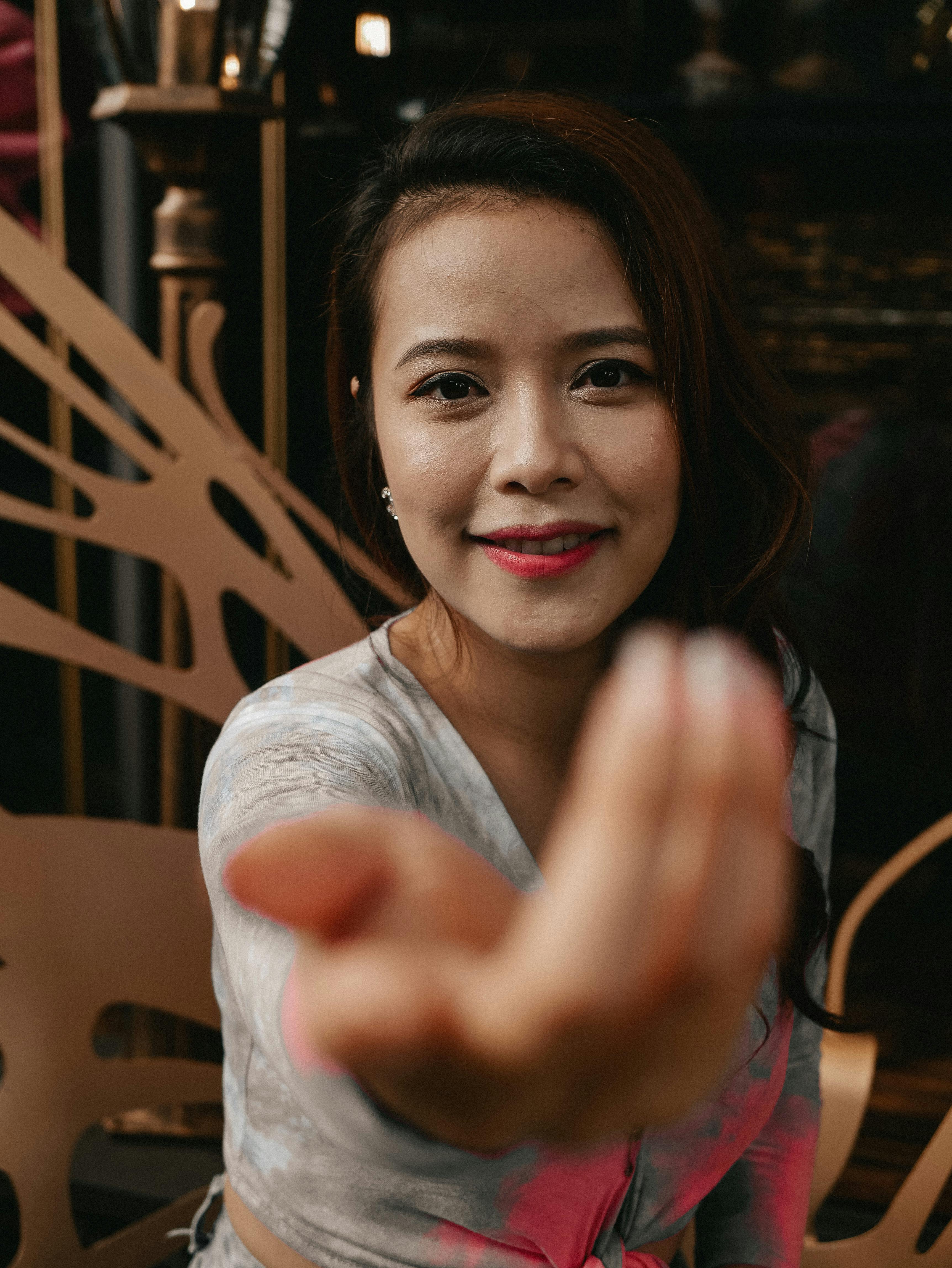 Woman Reaching Out Her Hand · Free Stock Photo