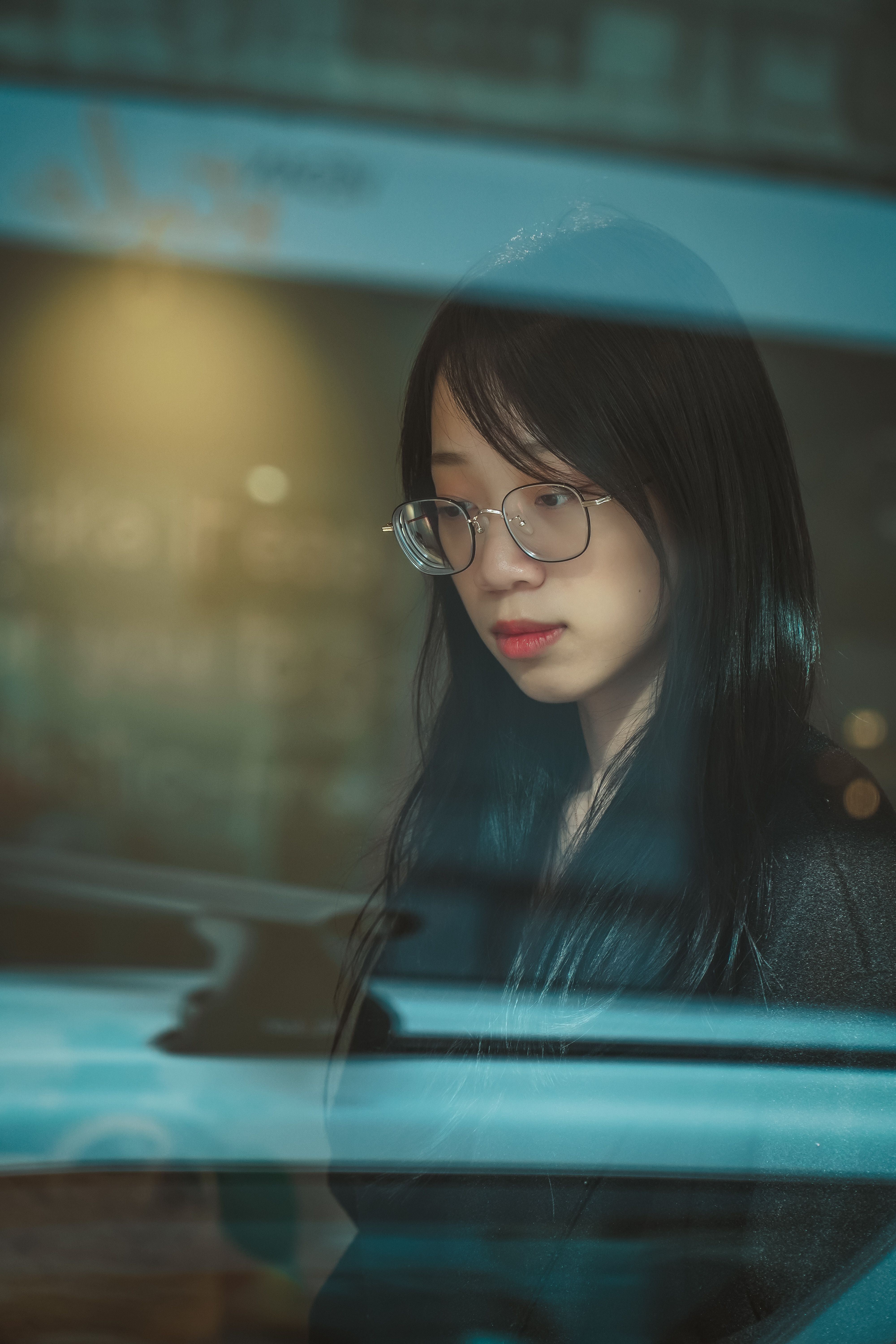 Woman Standing Beside a Window · Free Stock Photo