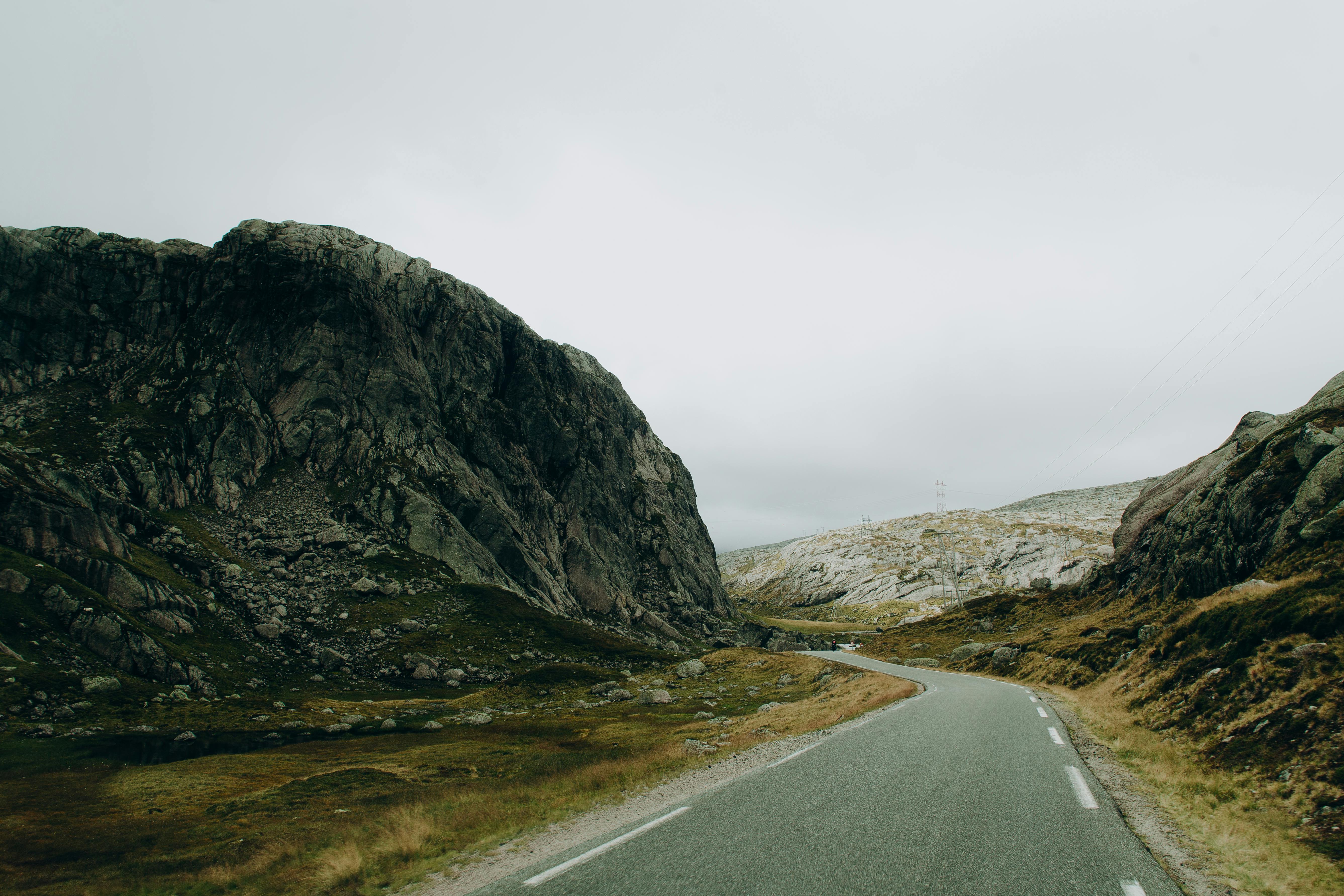 Gray Asphalt Road Near Gray Rocky Mountain · Free Stock Photo