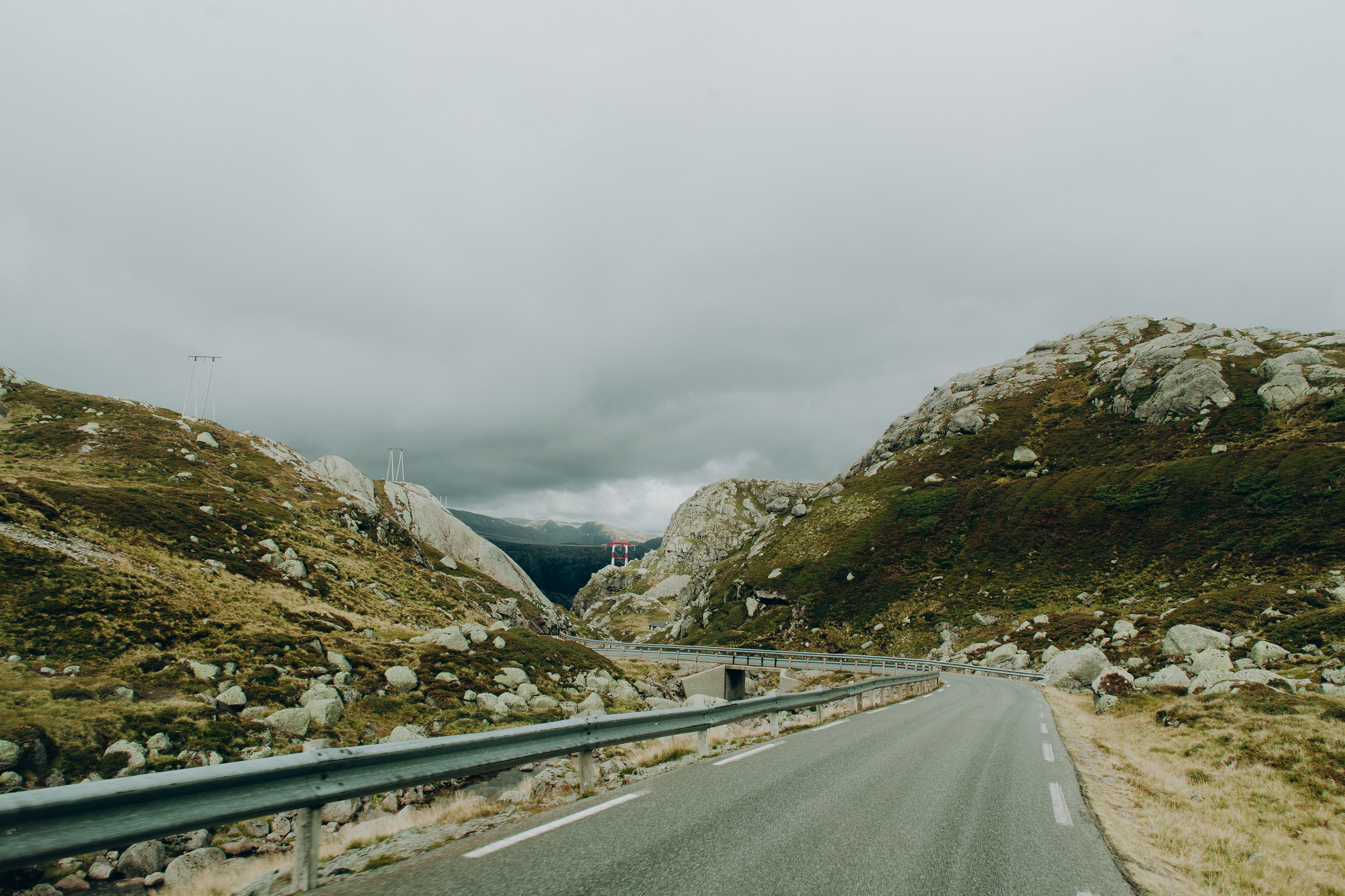 Photo of an Asphalt Road between Two Hills beneath a Foggy Sky · Free ...