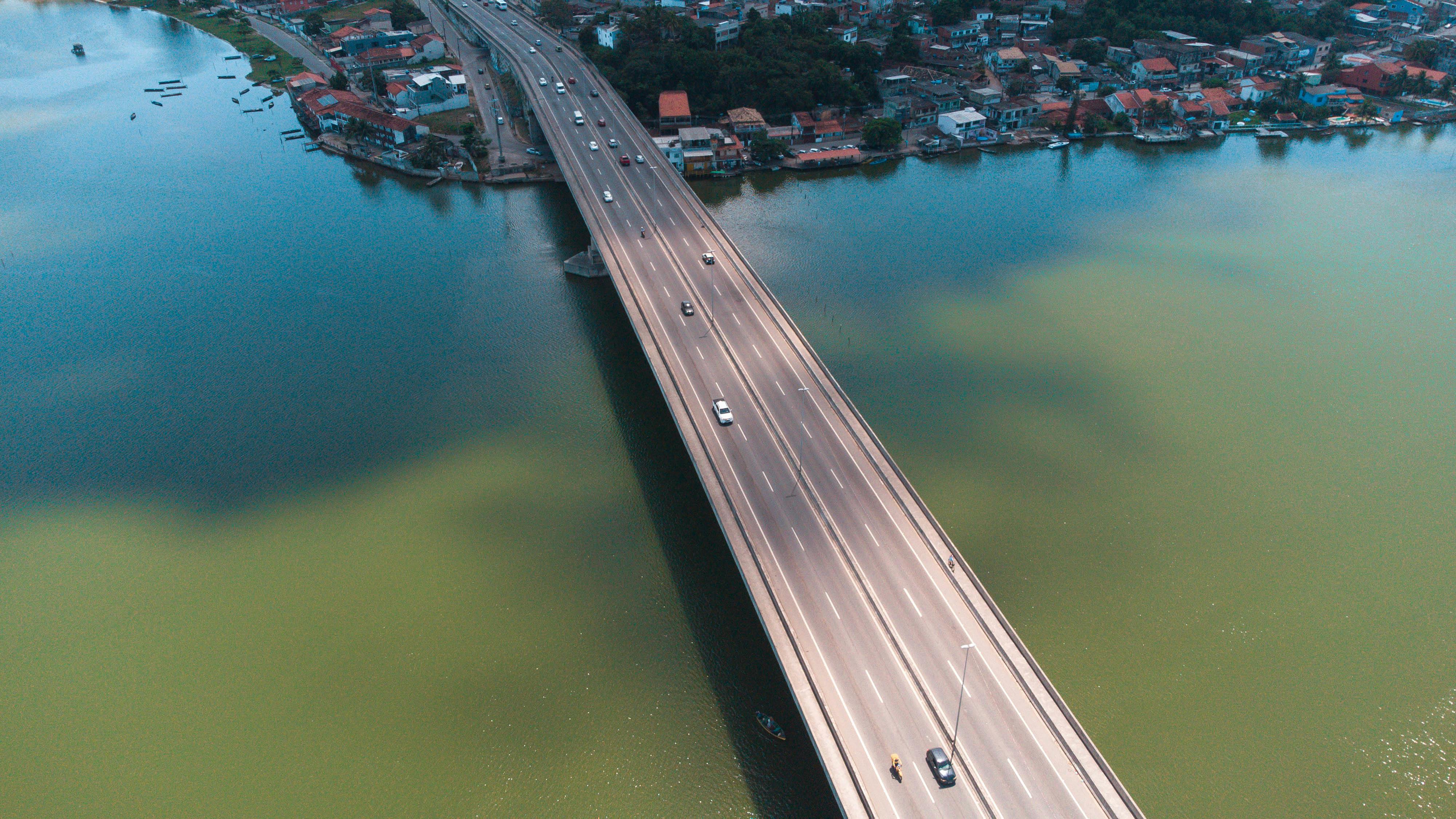 High Angle Shot of Cars on Bridge over a Body of Water · Free Stock Photo