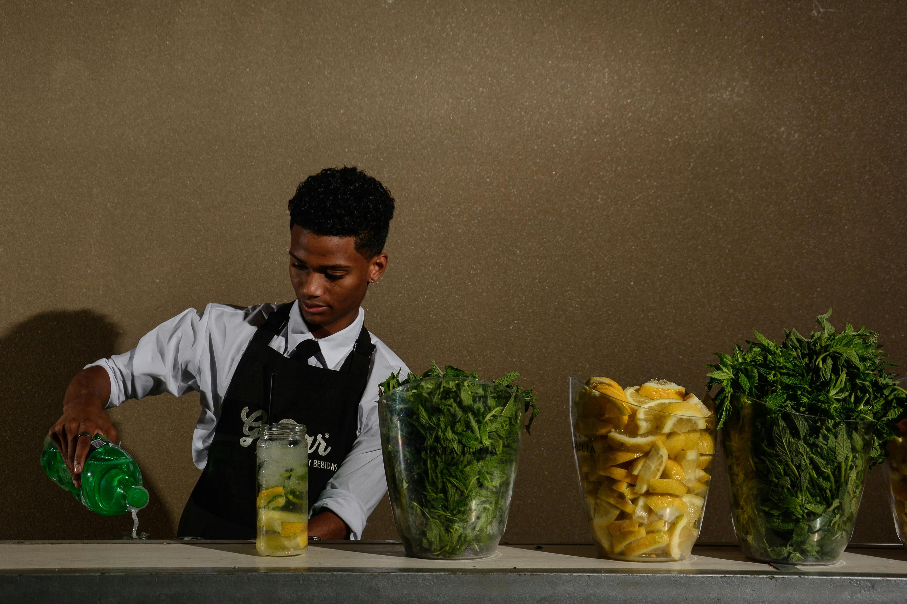 Bartender Standing Behind a bar · Free Stock Photo