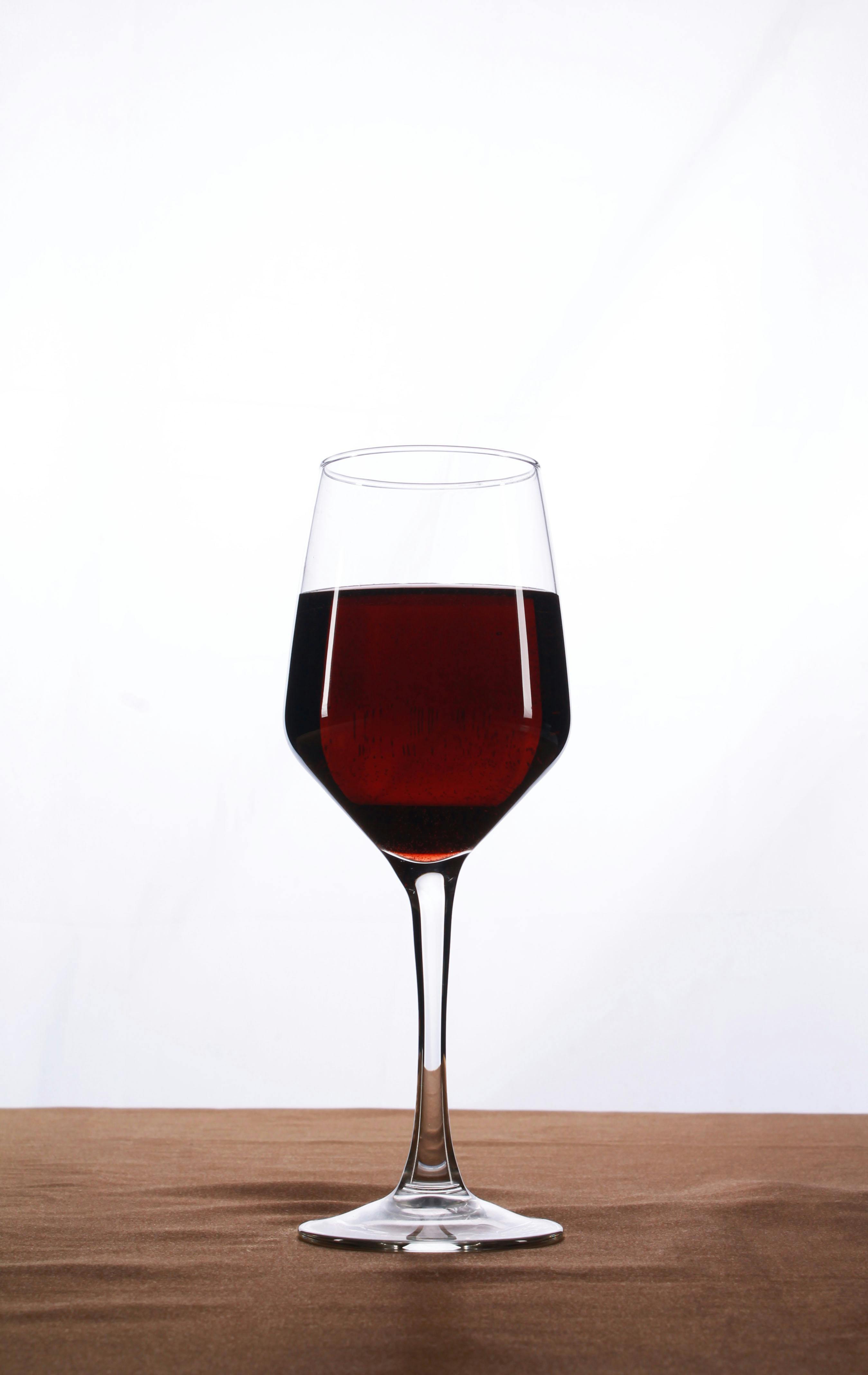 Red Wine on a Goblet Glass · Free Stock Photo