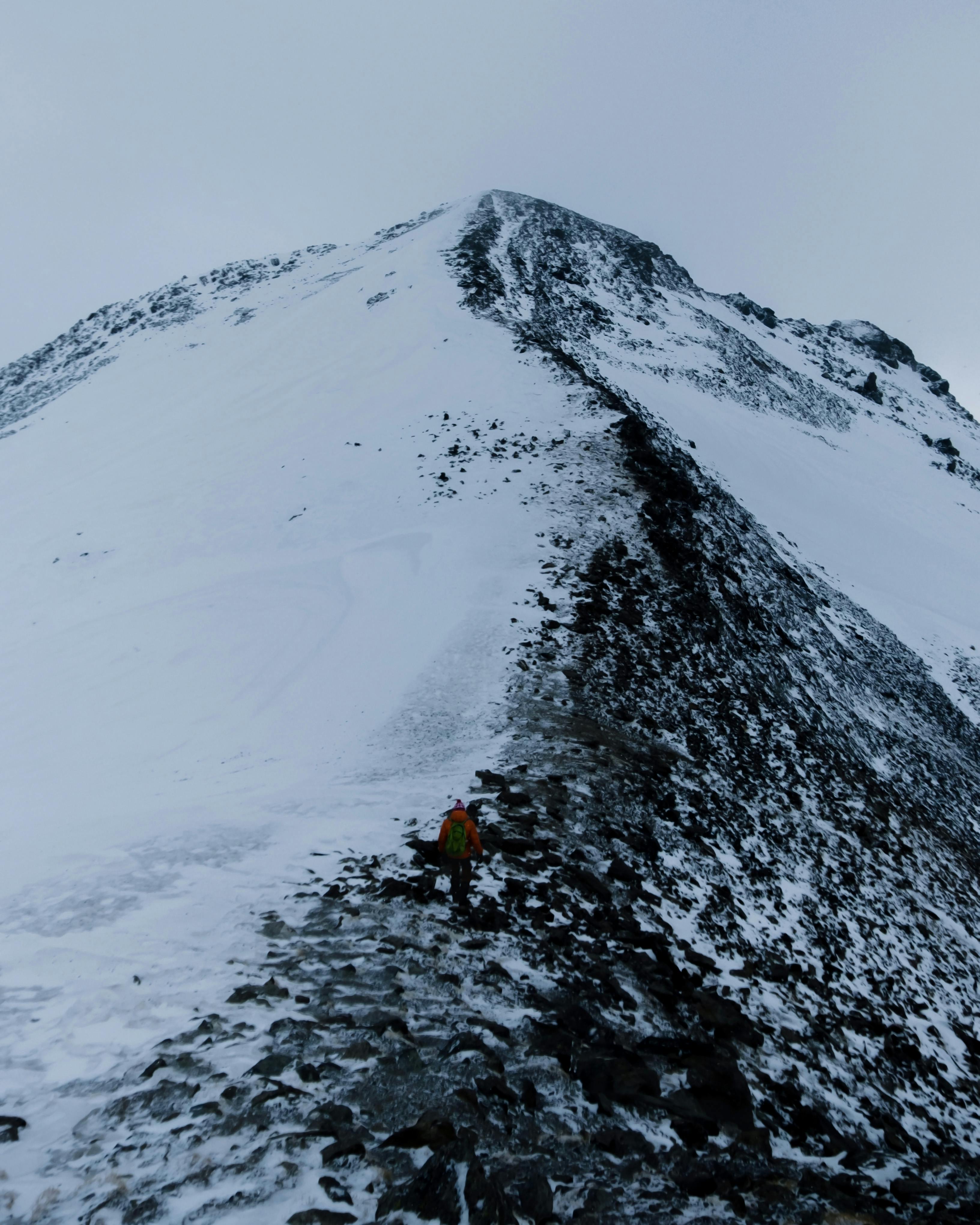 Snow Covered Mountain under Gloomy Sky · Free Stock Photo