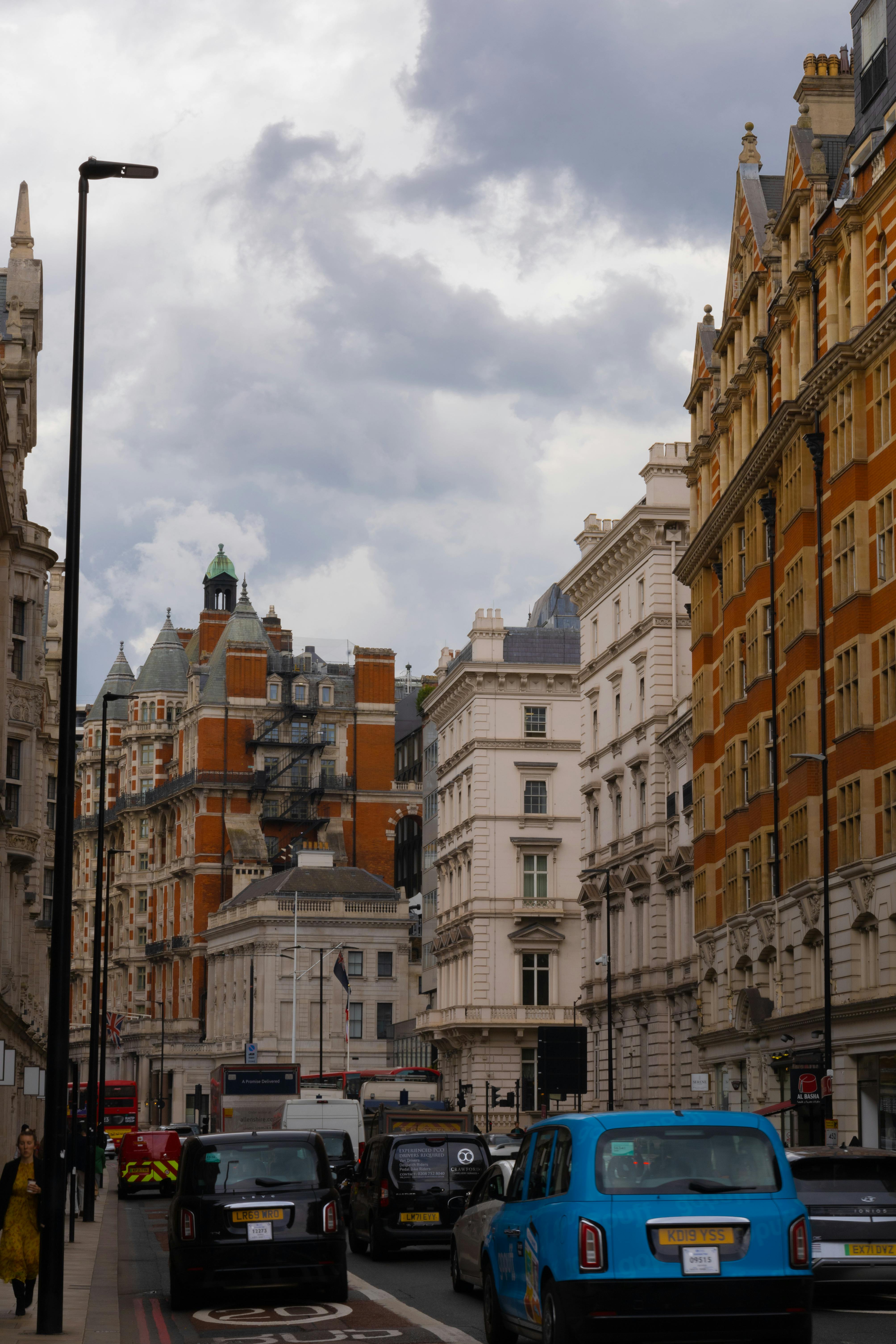Parked Cars between the Concrete Buildings · Free Stock Photo