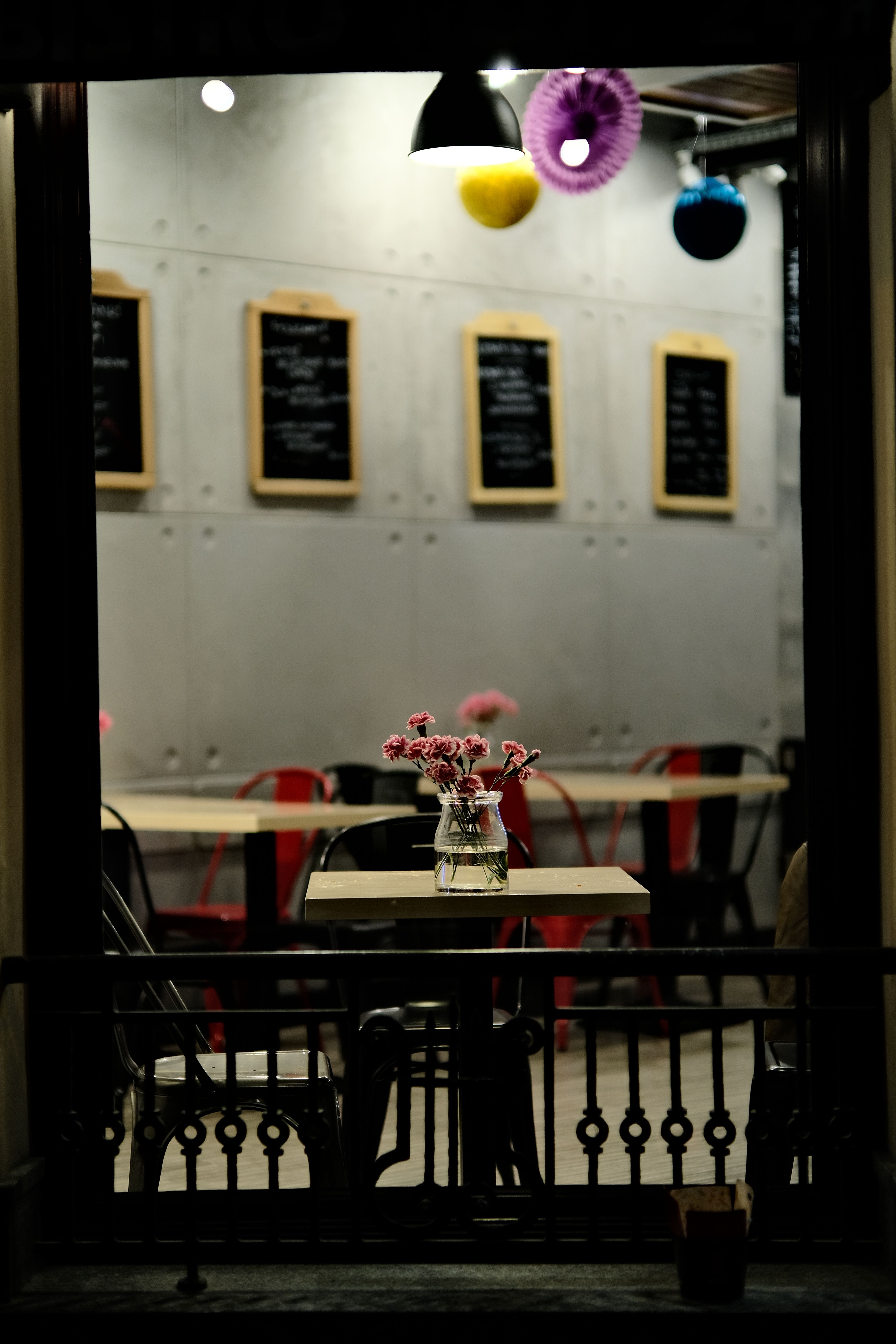Restaurant Interior Photographed From the Outside · Free Stock Photo