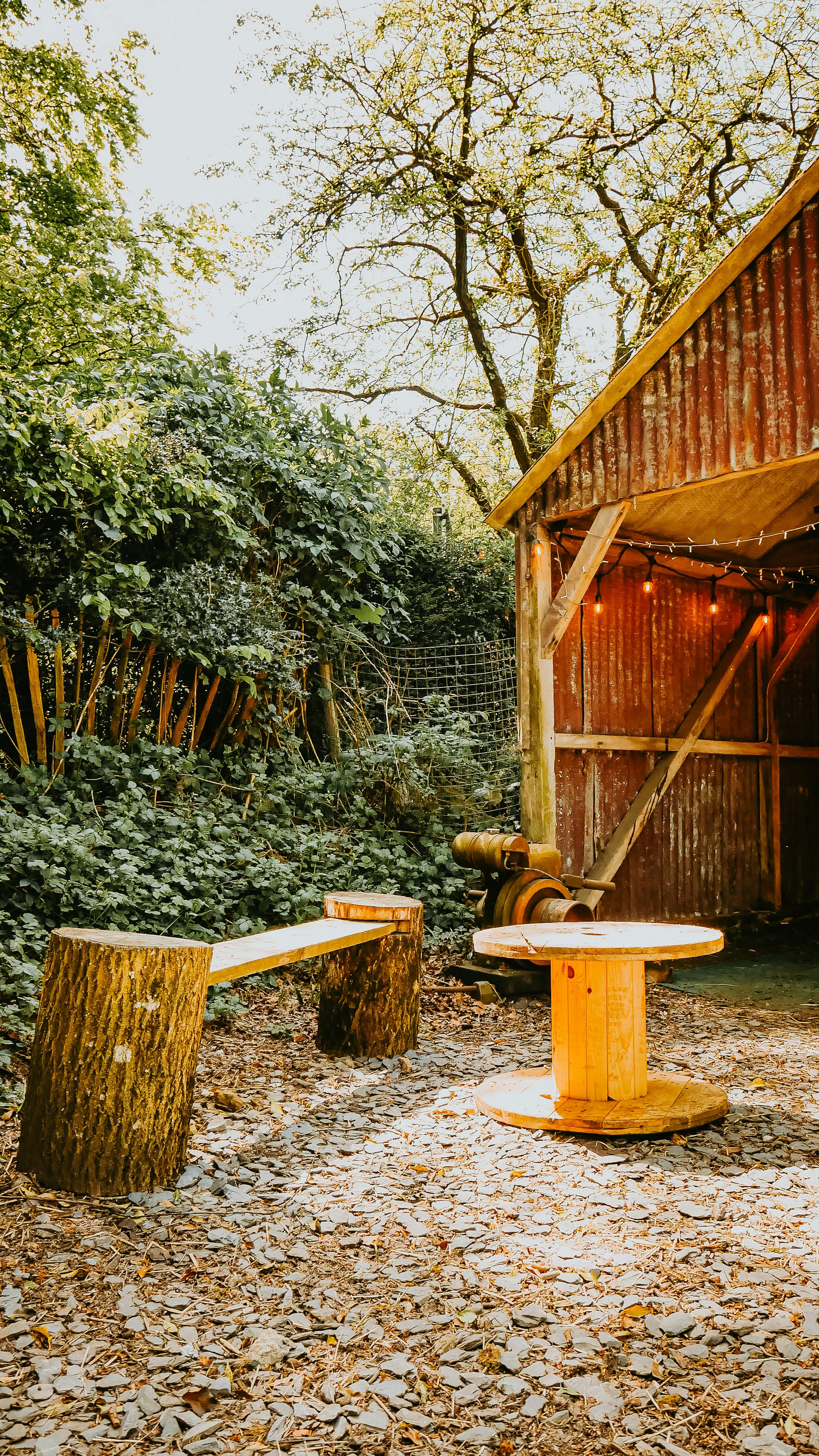 Wooden Table and a Bench by a Barn · Free Stock Photo