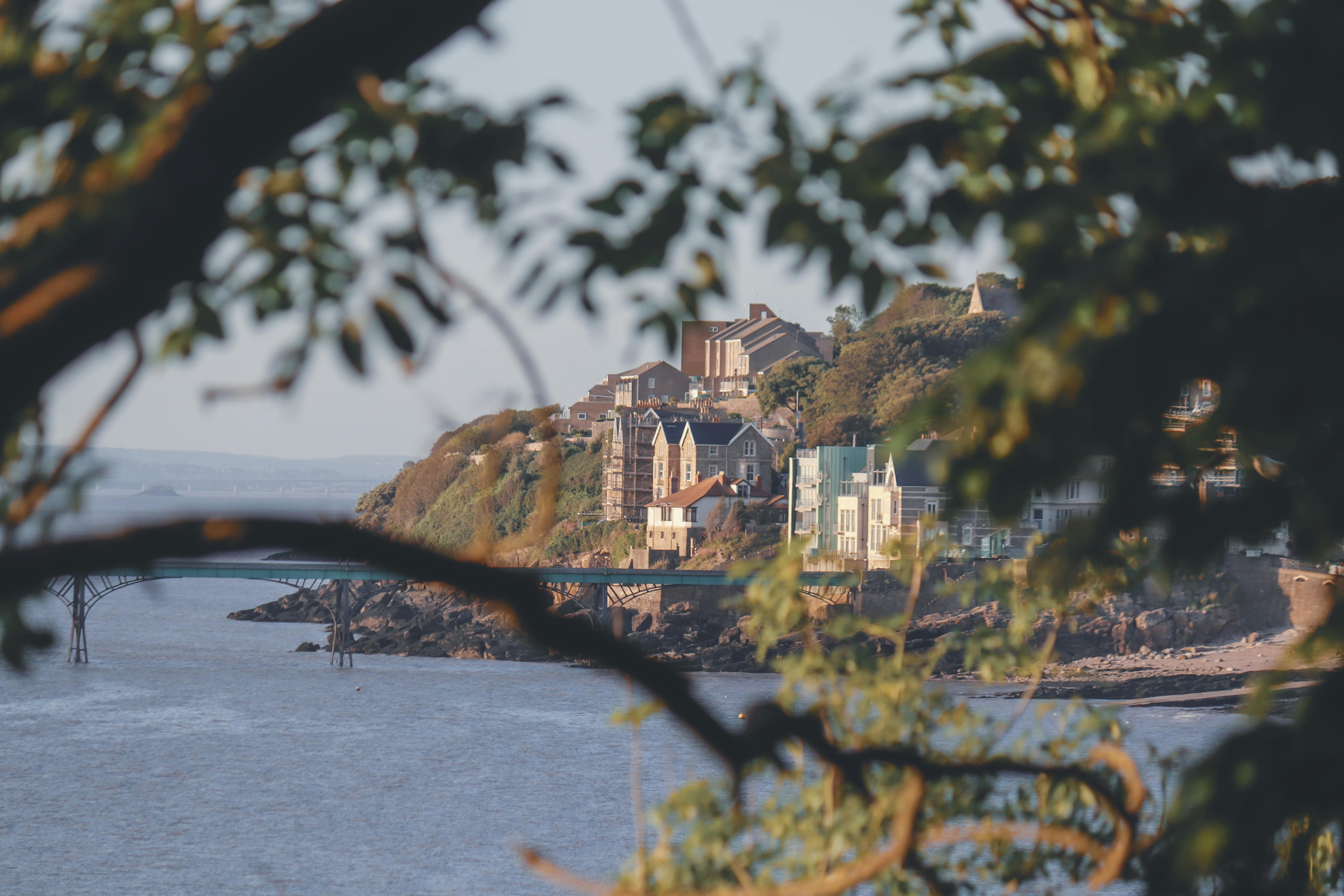 Concrete Buildings Beside the Ocean · Free Stock Photo