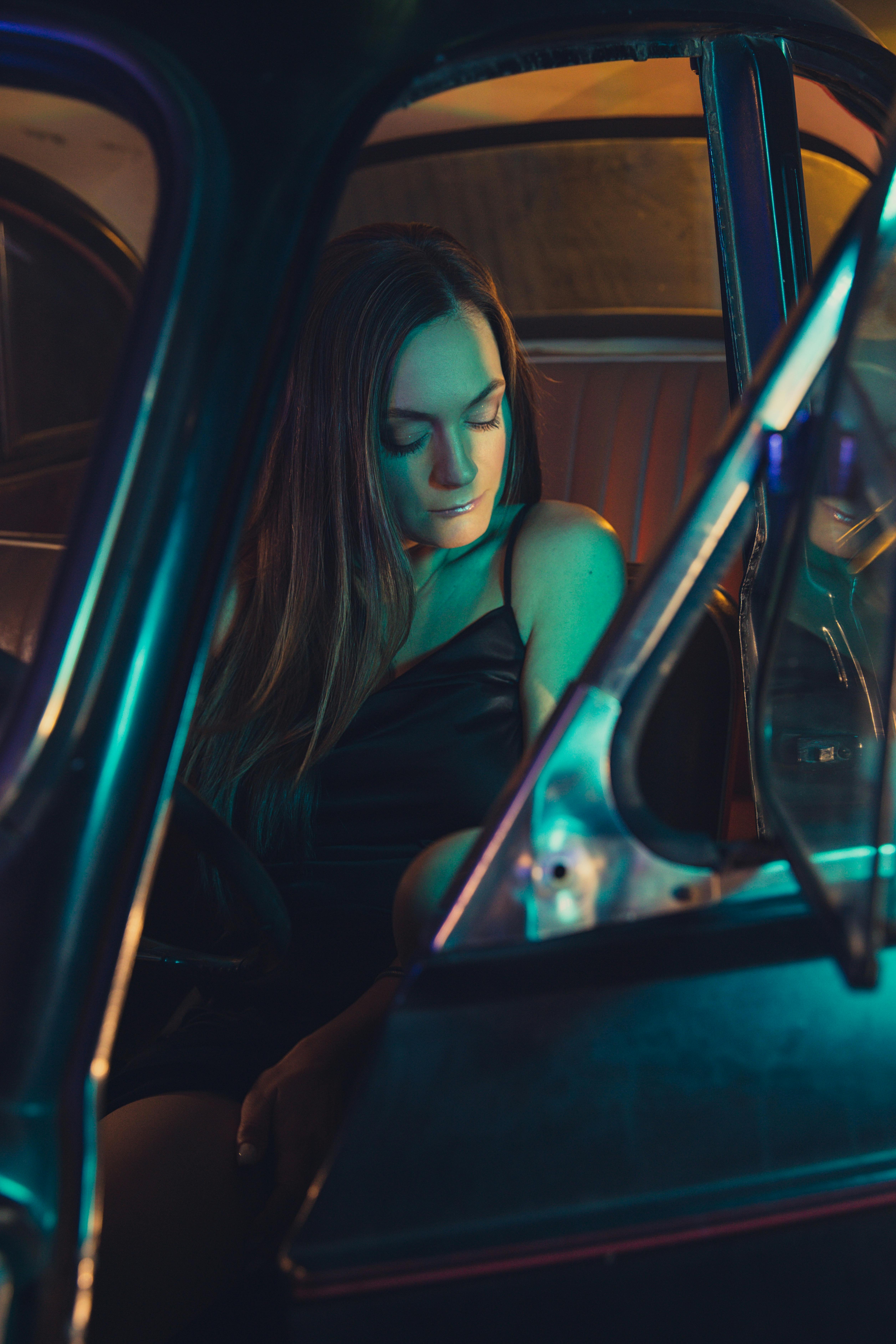 Woman Sitting behind Window · Free Stock Photo