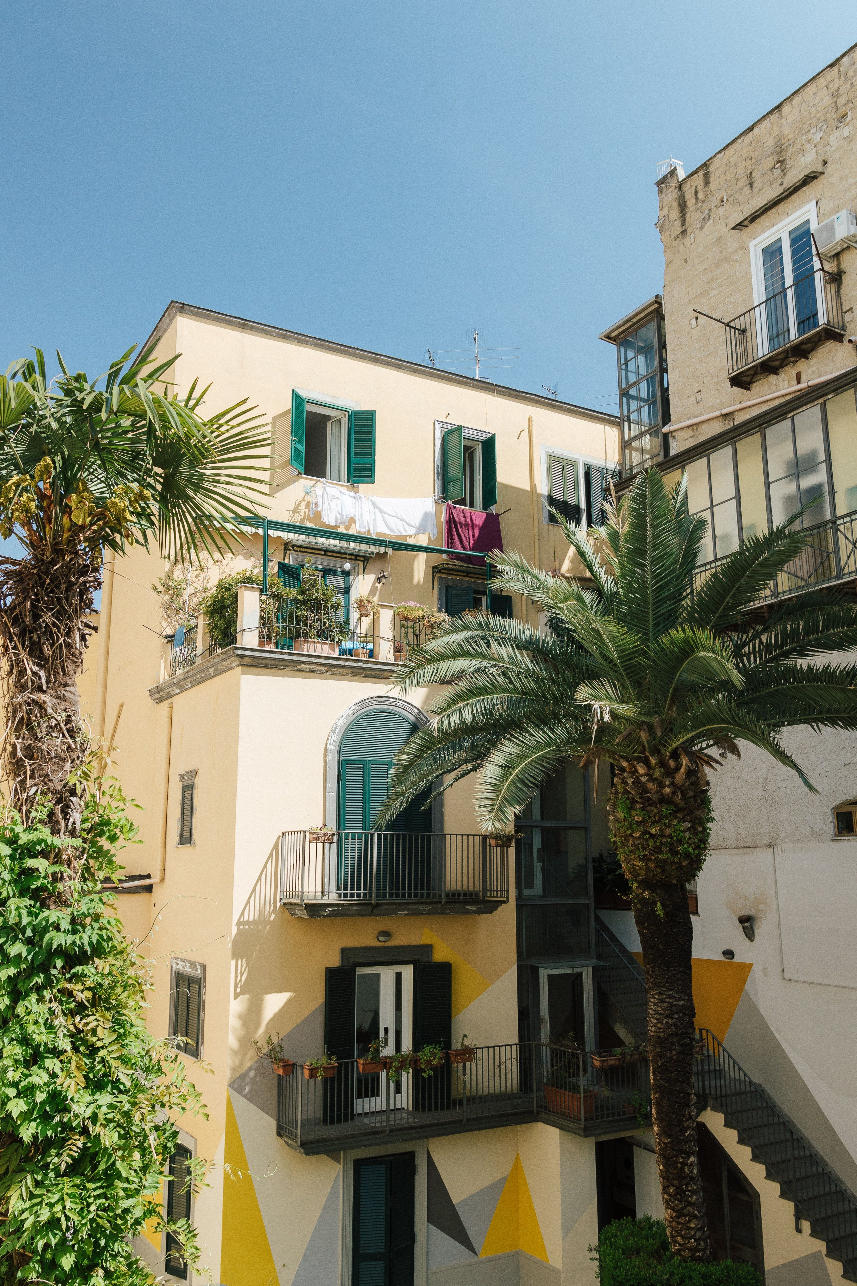 Architectural Photography of Three Pink, Blue, and Yellow Buildings ...