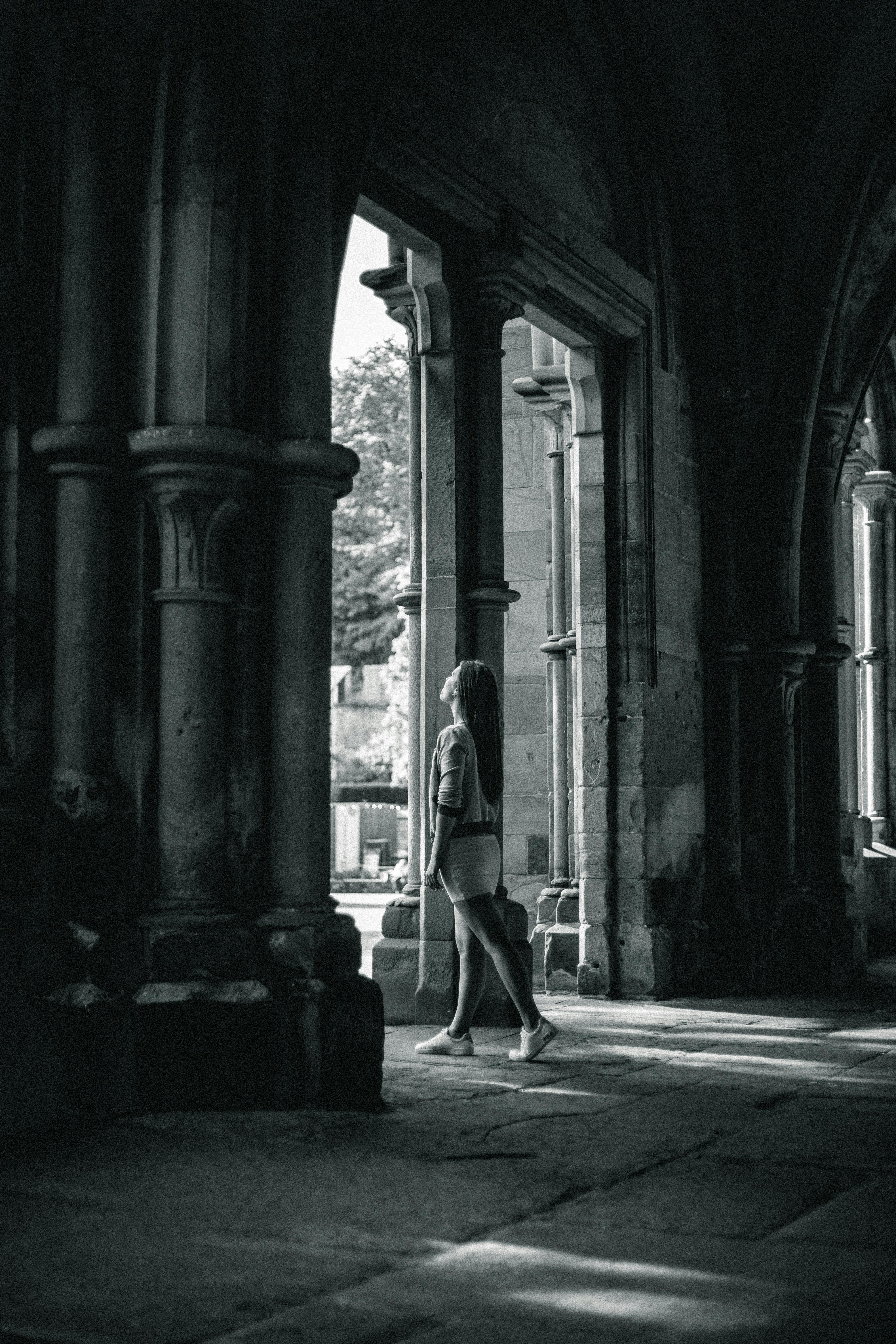 Woman Standing Between Columns · Free Stock Photo