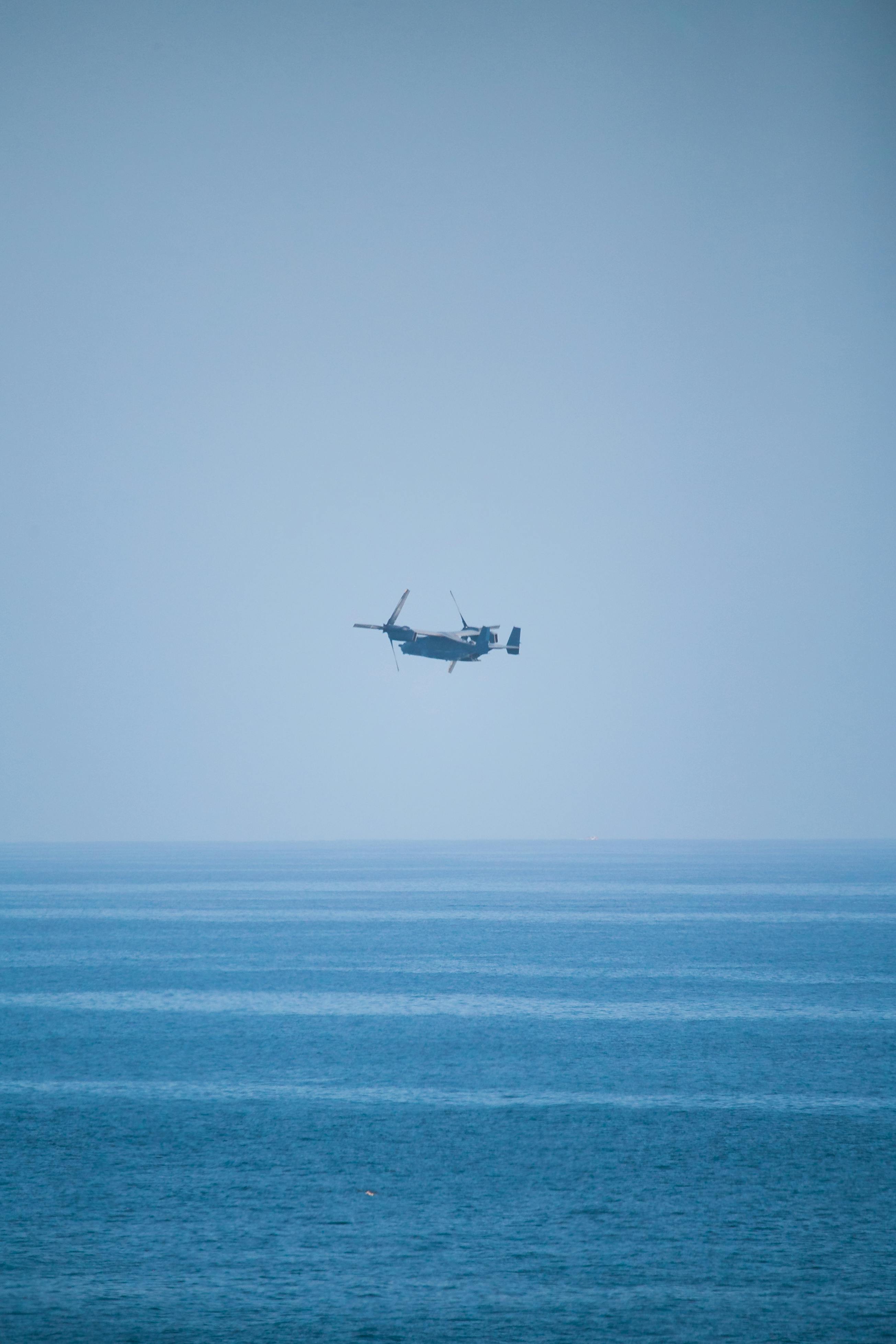 Army Helicopter Flying Flying Above the Sea · Free Stock Photo