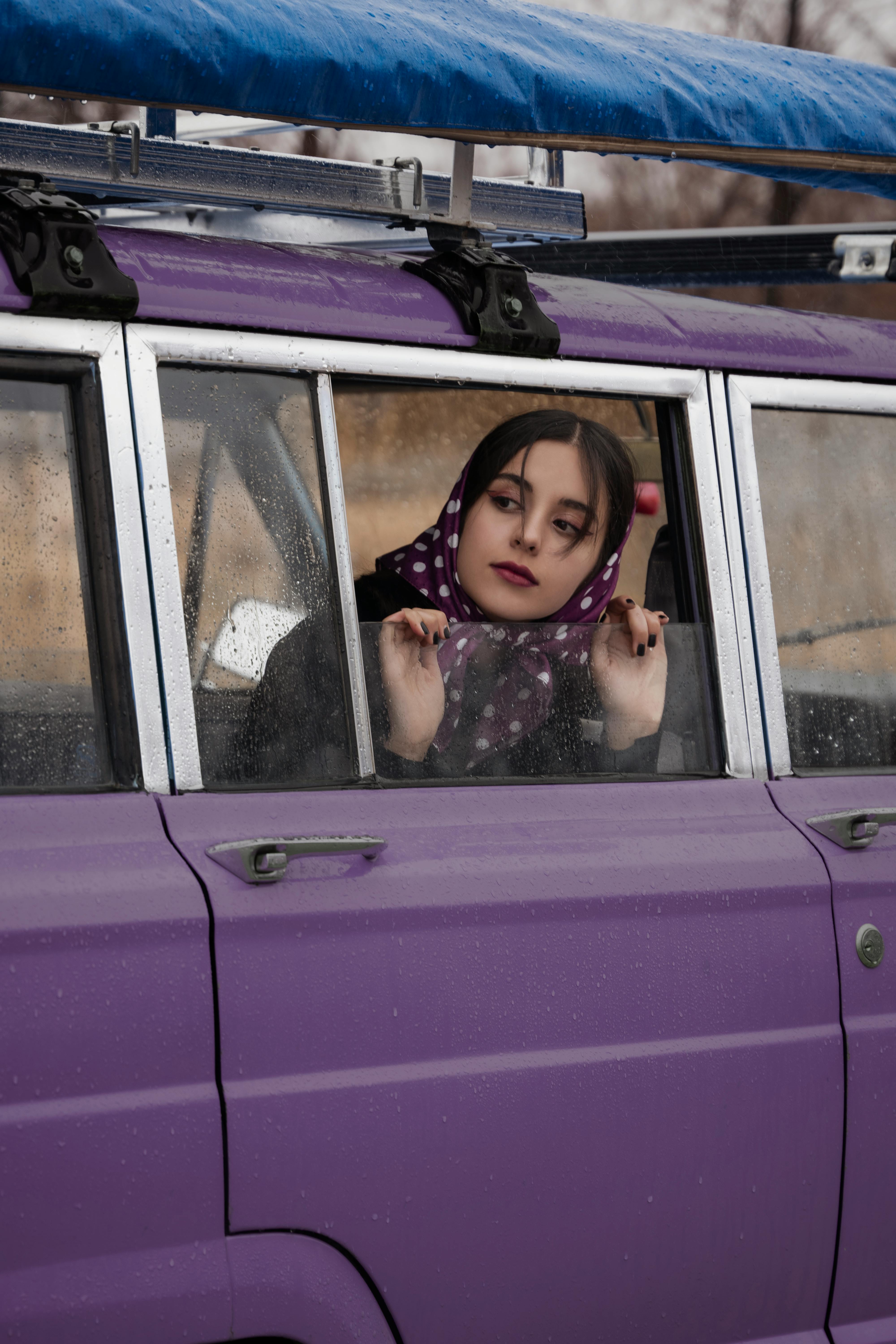 A Woman Looking Outside the Car Window · Free Stock Photo
