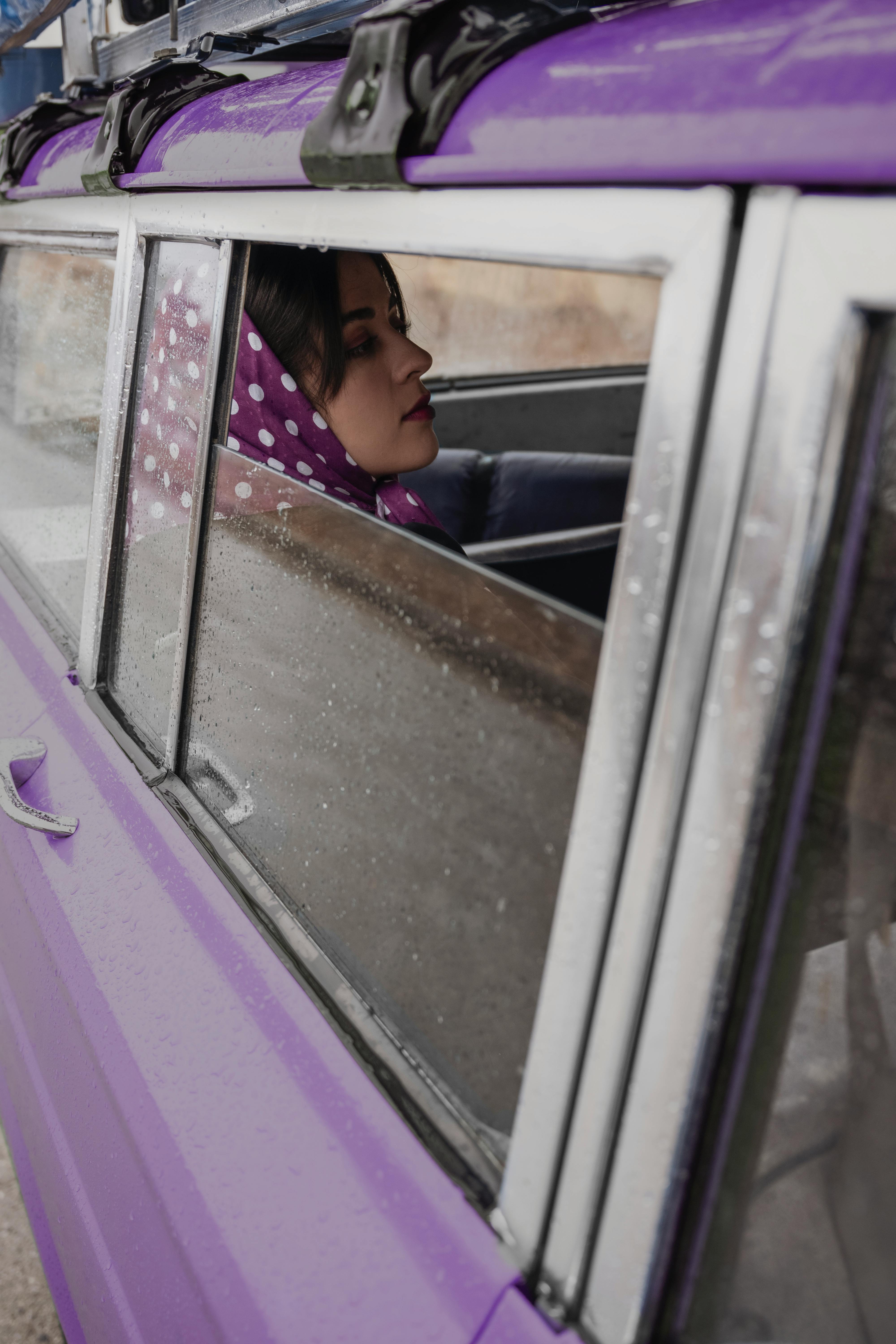 A Woman Looking Outside the Car Window · Free Stock Photo