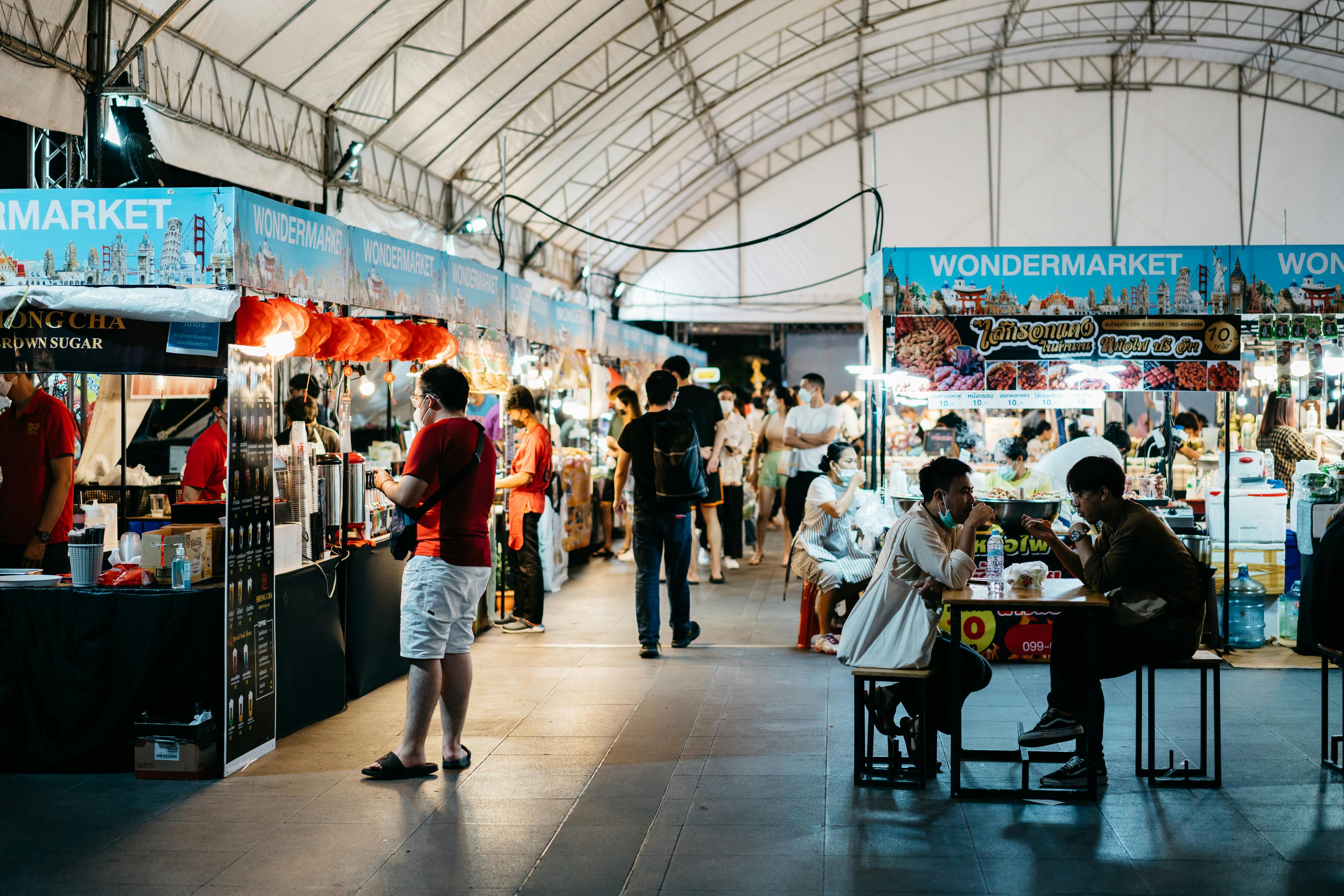 People Inside a Building with Food Stalls · Free Stock Photo