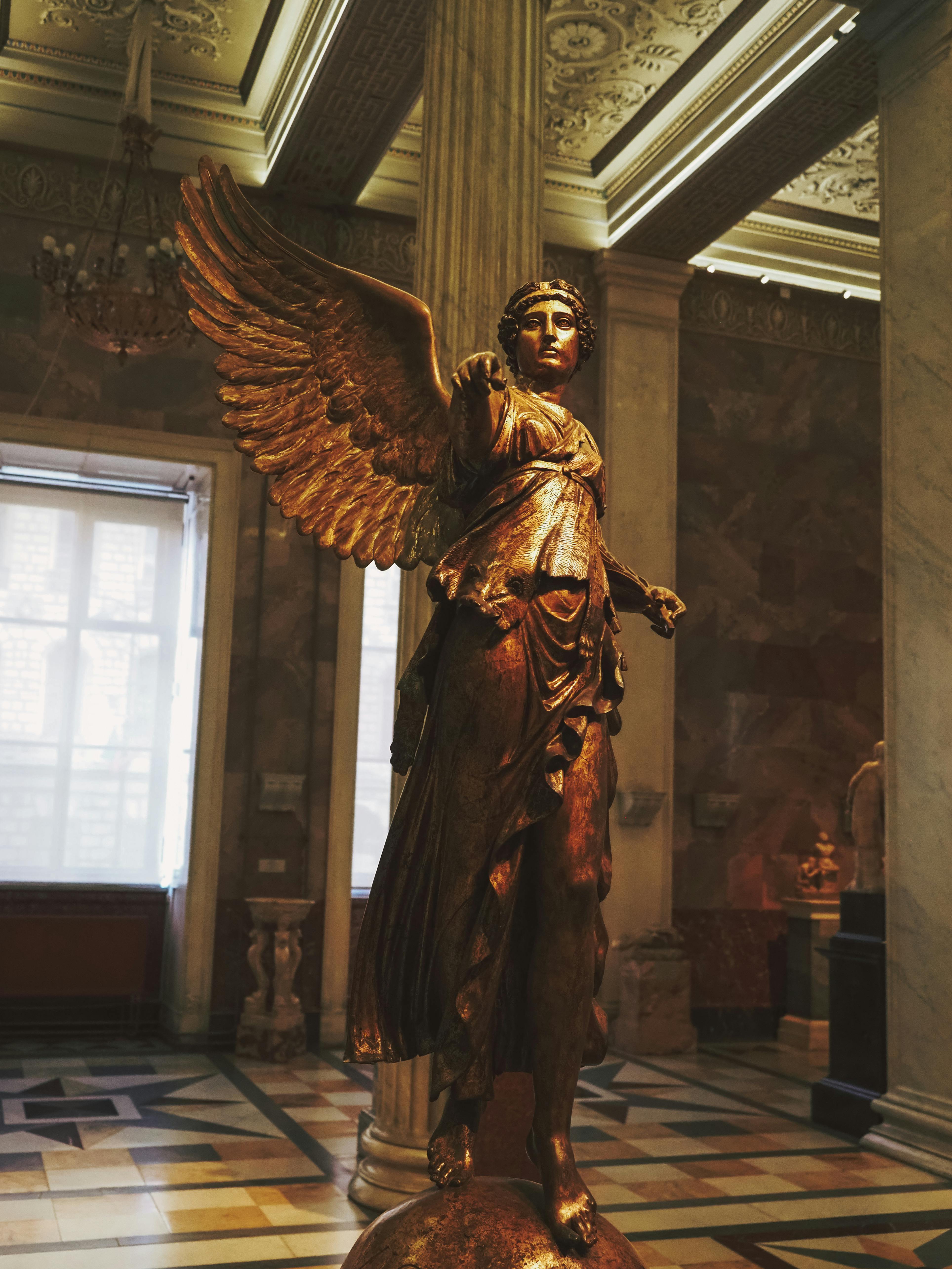 Statue of an Angel on a Pillar · Free Stock Photo