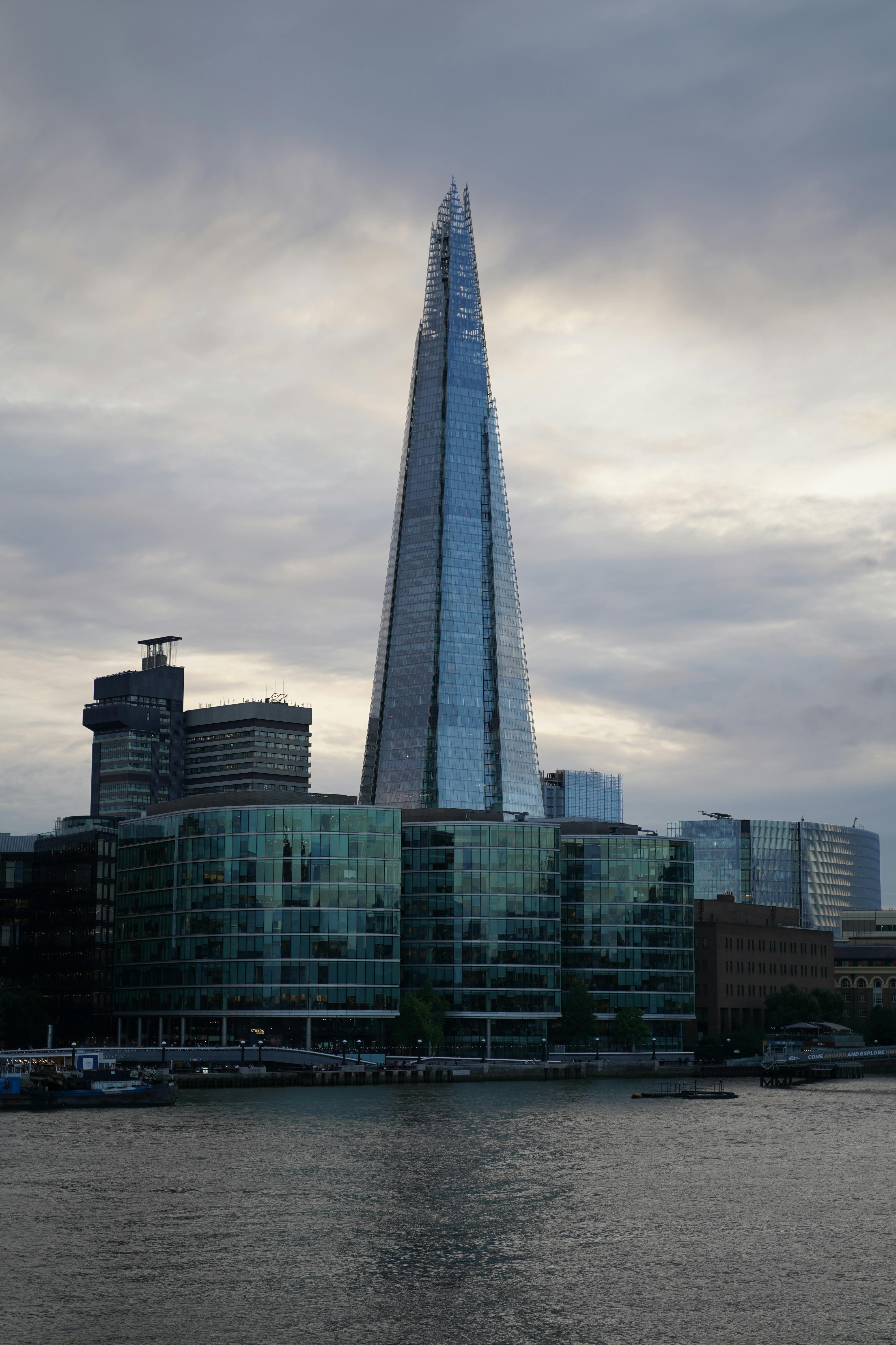 Waterfront with Spiky Glass Skyscraper · Free Stock Photo
