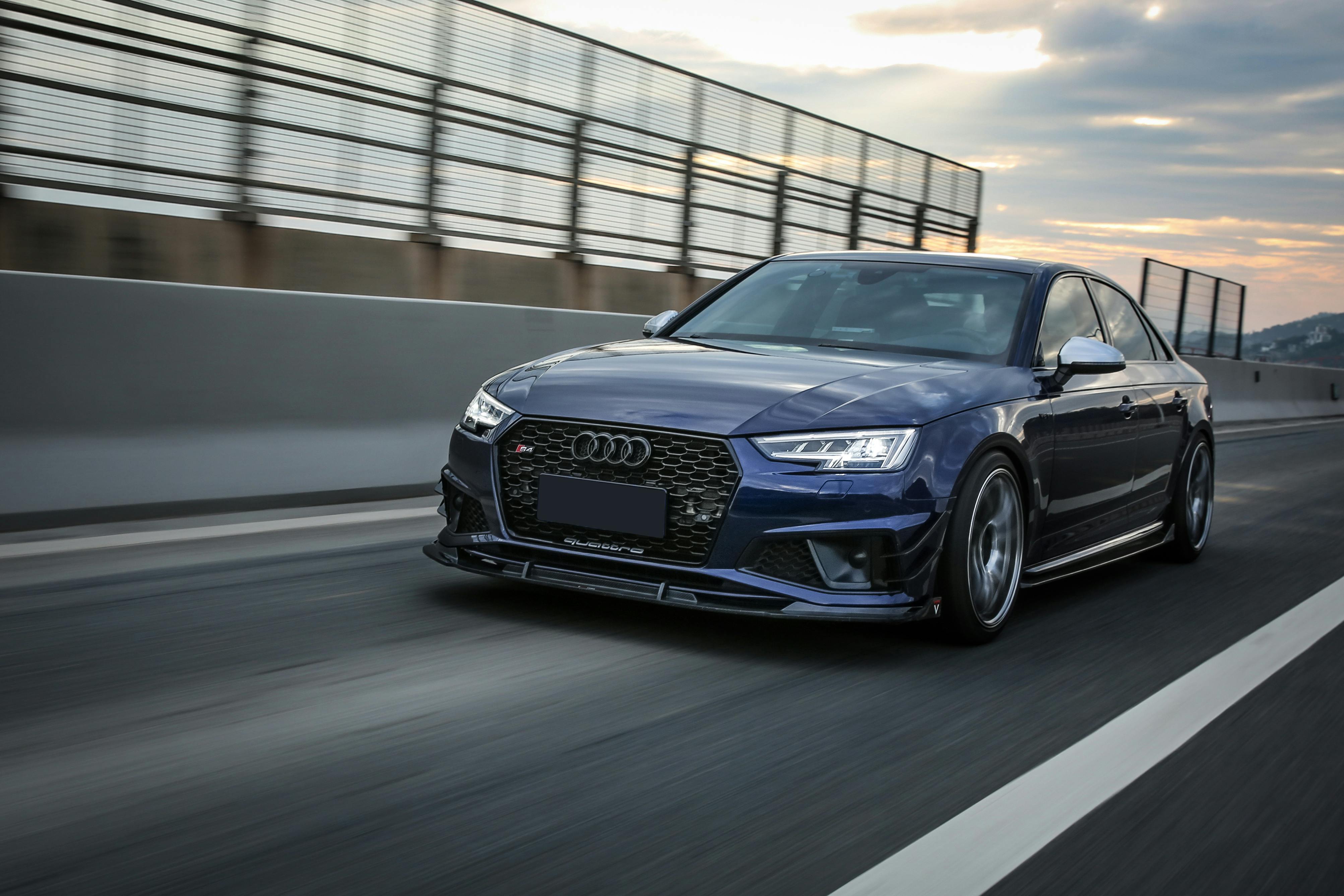 Blue Car Driving Fast on Asphalt Road · Free Stock Photo