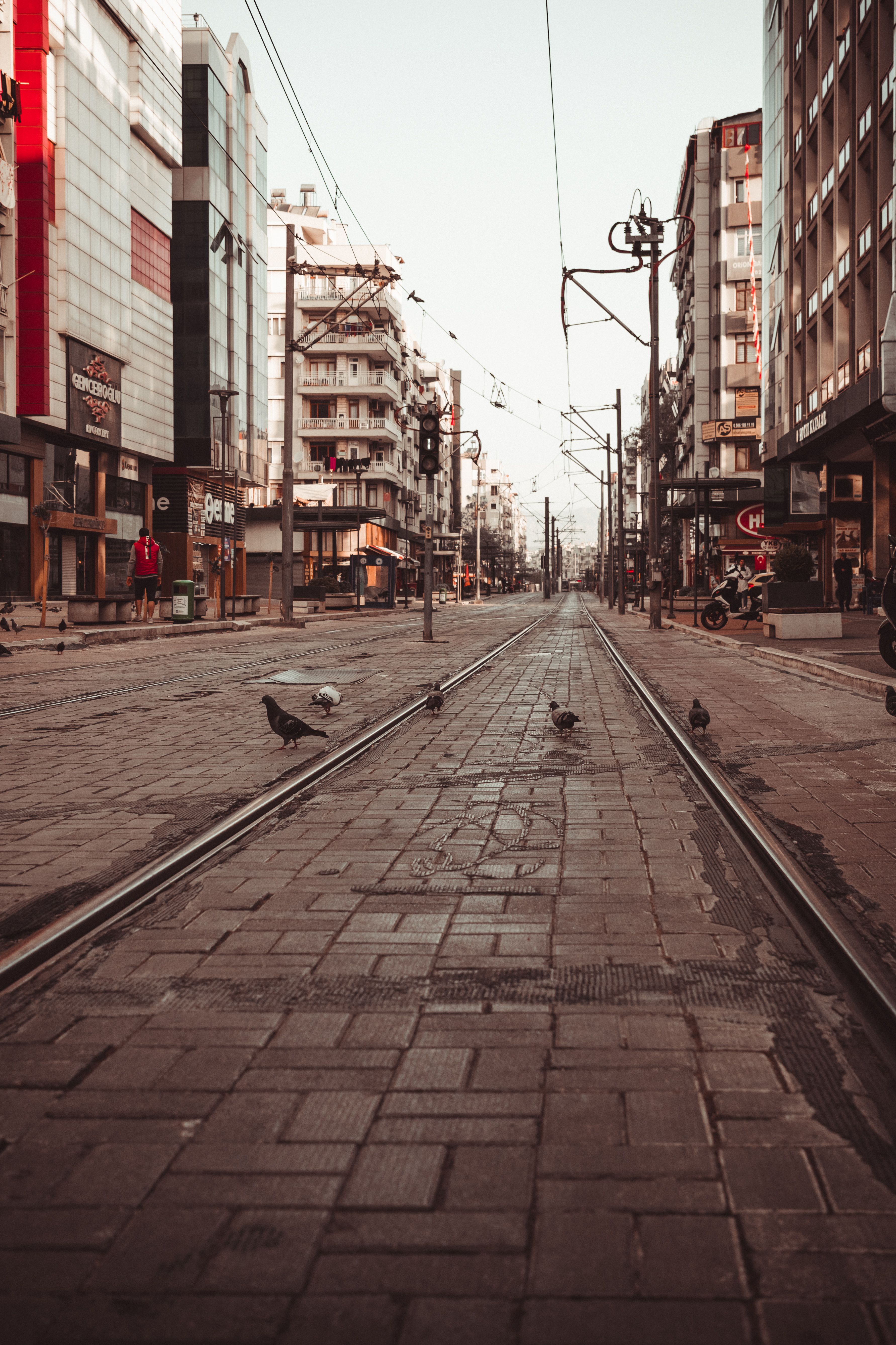 Photo of People Between Buildings · Free Stock Photo