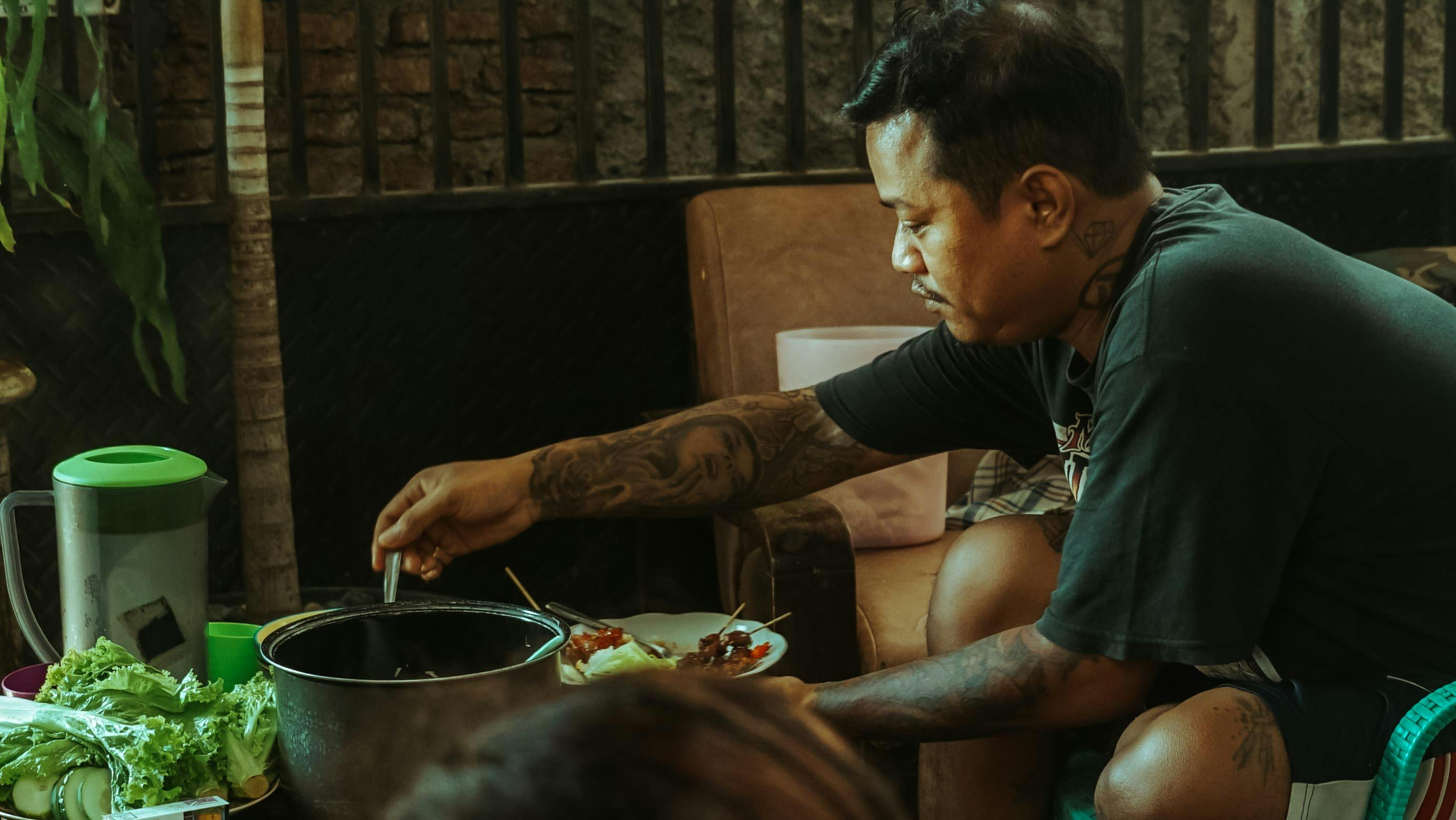 Man and Woman Eating at the Table · Free Stock Photo