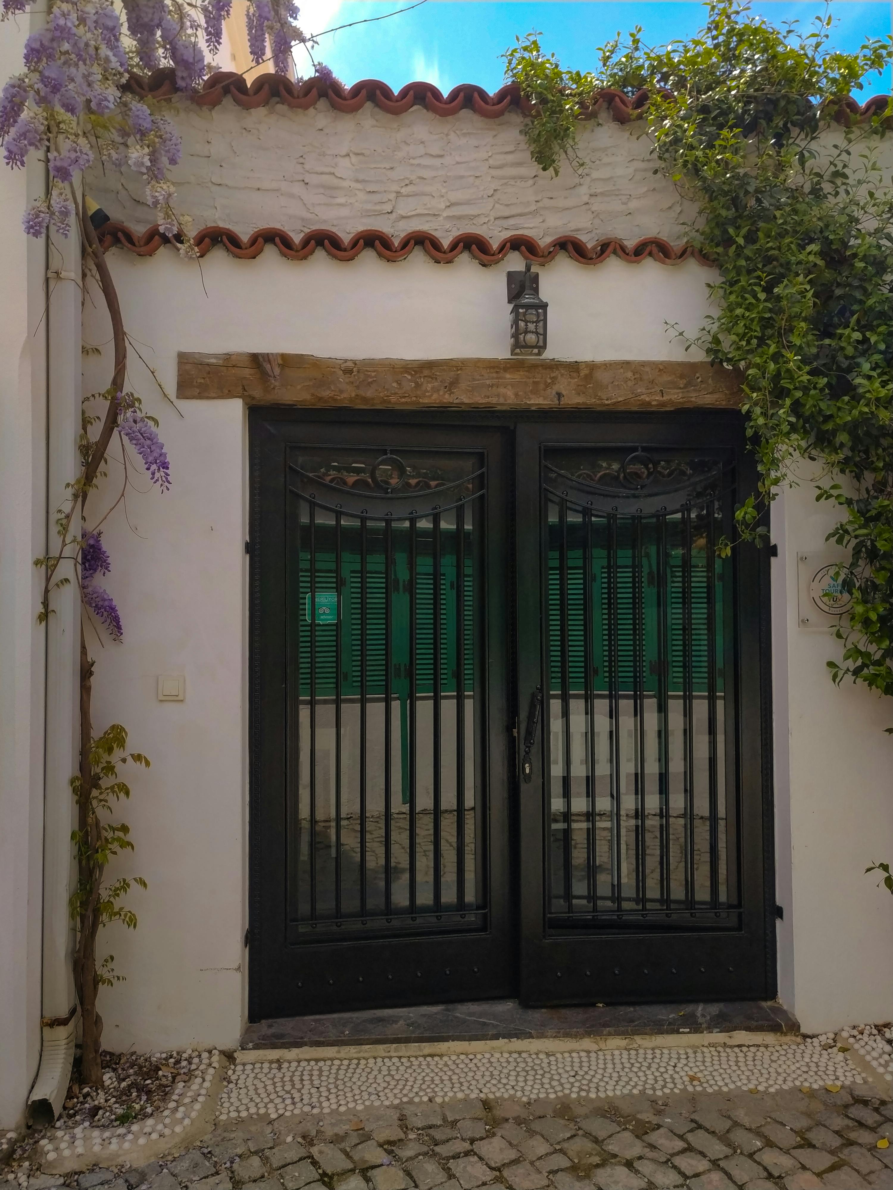 A Metal Gate on a Concrete House · Free Stock Photo