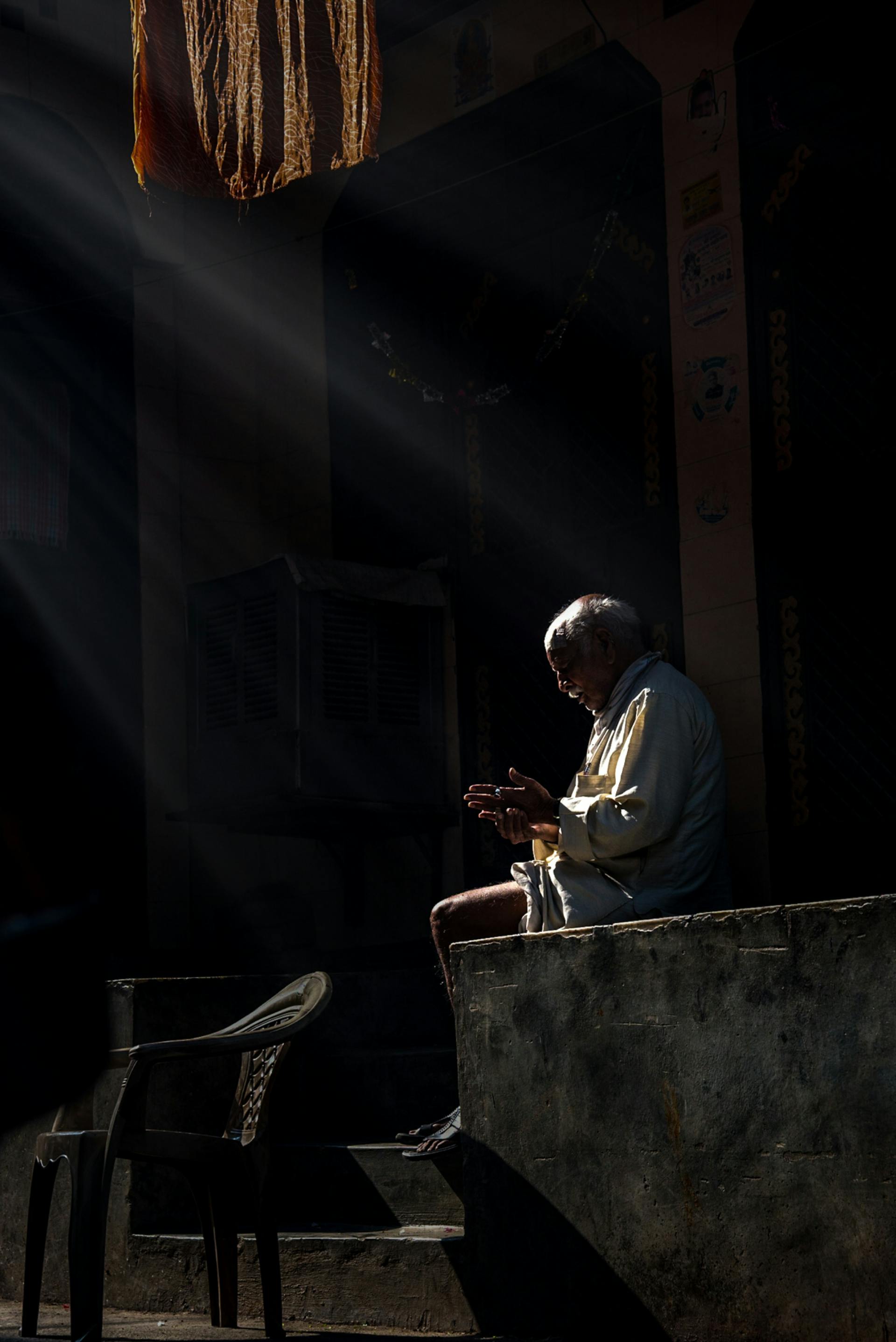 Man Sitting While Praying · Free Stock Photo